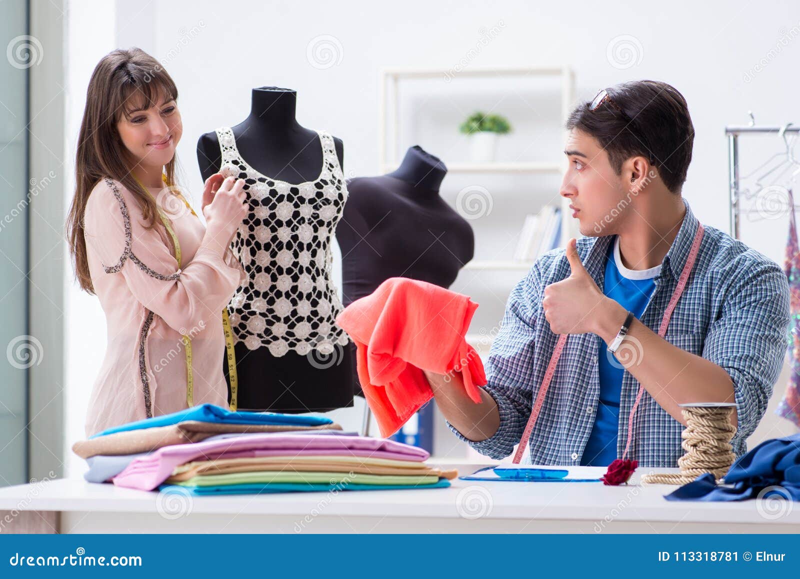 The Male Tailor with Female Student in Workshop Stock Image - Image of ...