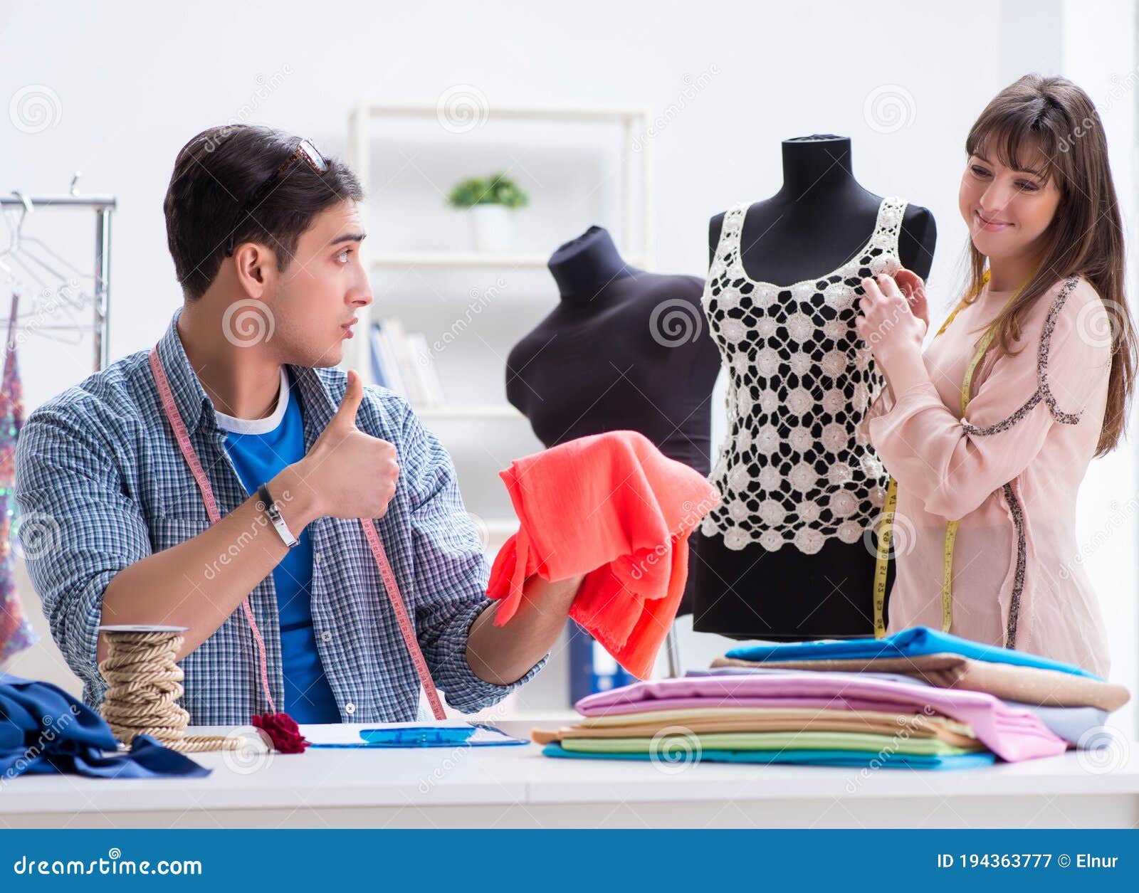 Male Tailor with Female Student in Workshop Stock Image - Image of ...
