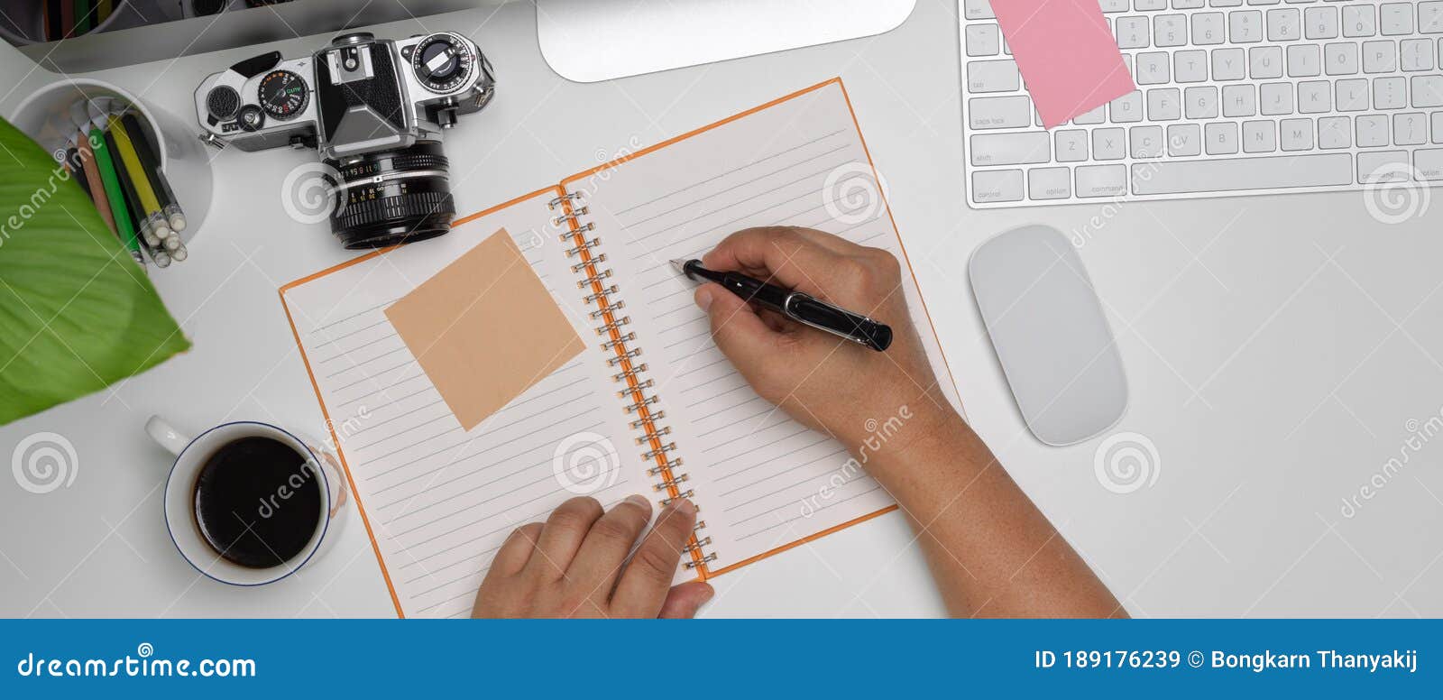 Male Taking Note on Blank Notebook on White Office Desk with Computer ...