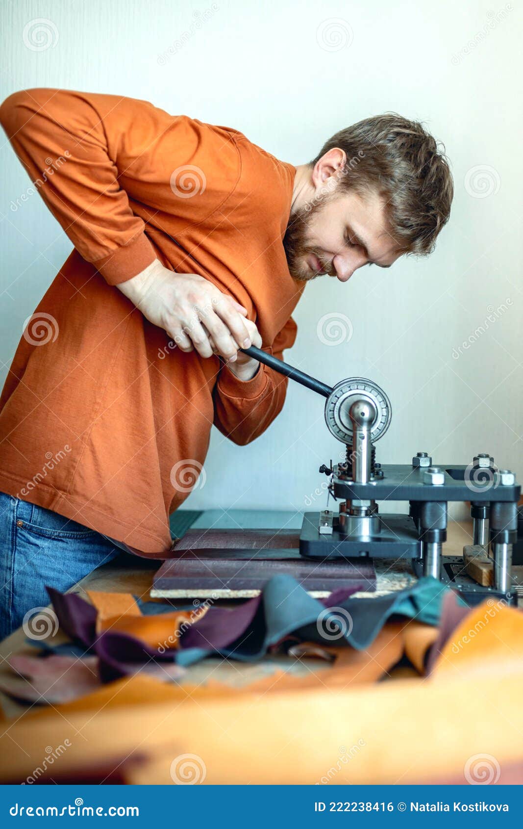Male Tanner Stamping Stuff Use Awl And Machine Device Working At ...
