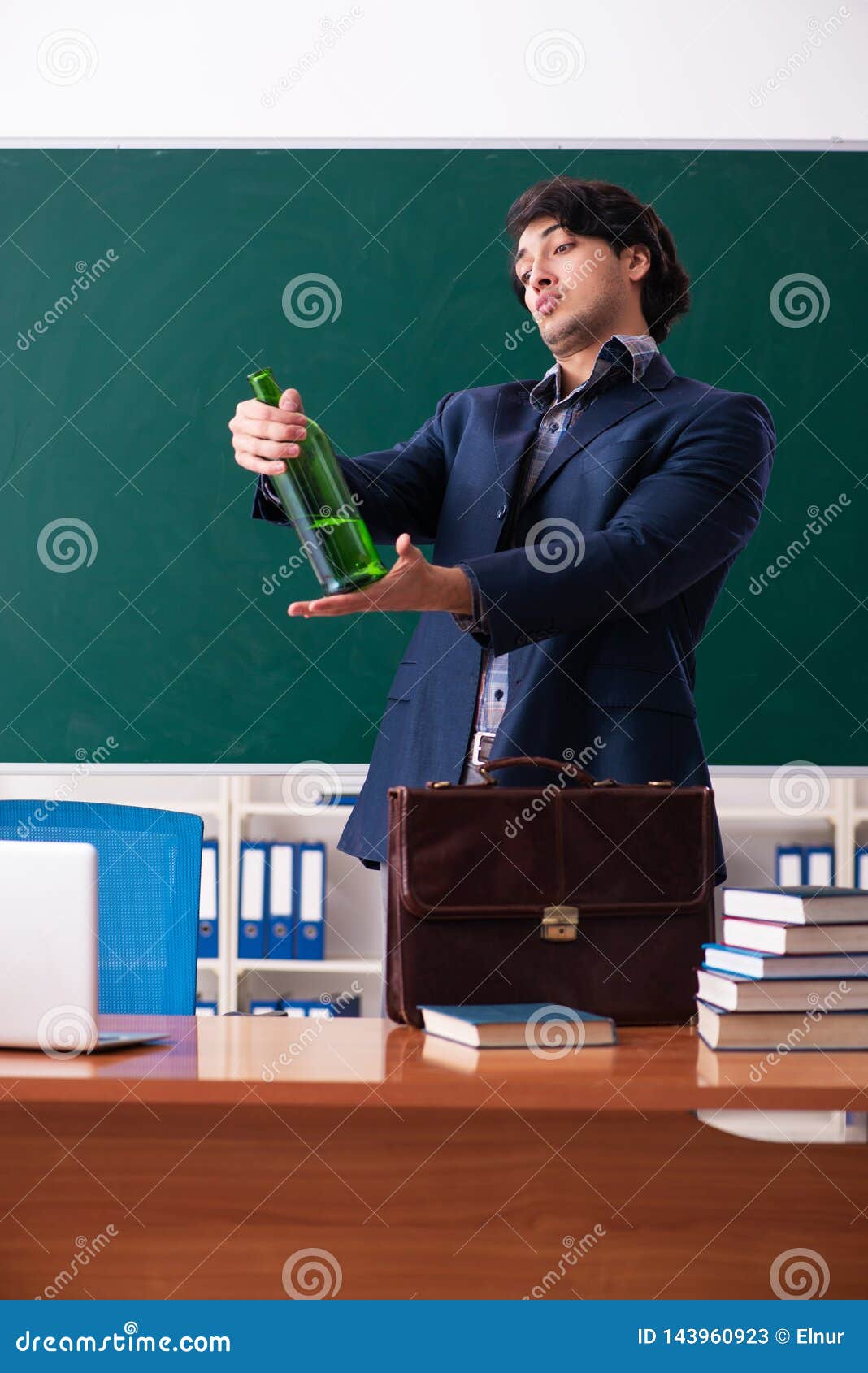 The Male Teacher Drinking in the Classroom Stock Image - Image of ...