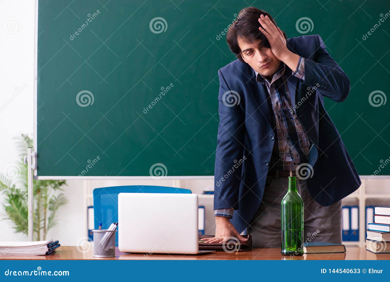 The Male Teacher Drinking in the Classroom Stock Image - Image of drunk ...