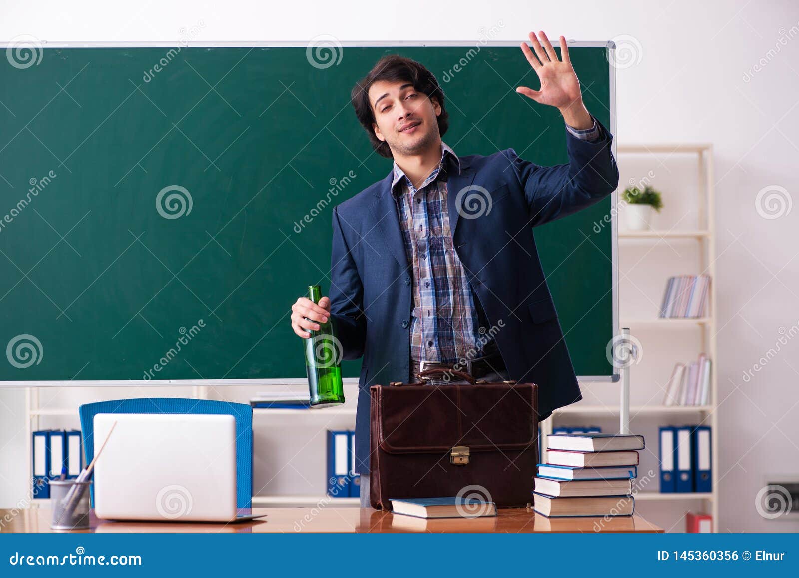 The Male Teacher Drinking in the Classroom Stock Photo - Image of ...