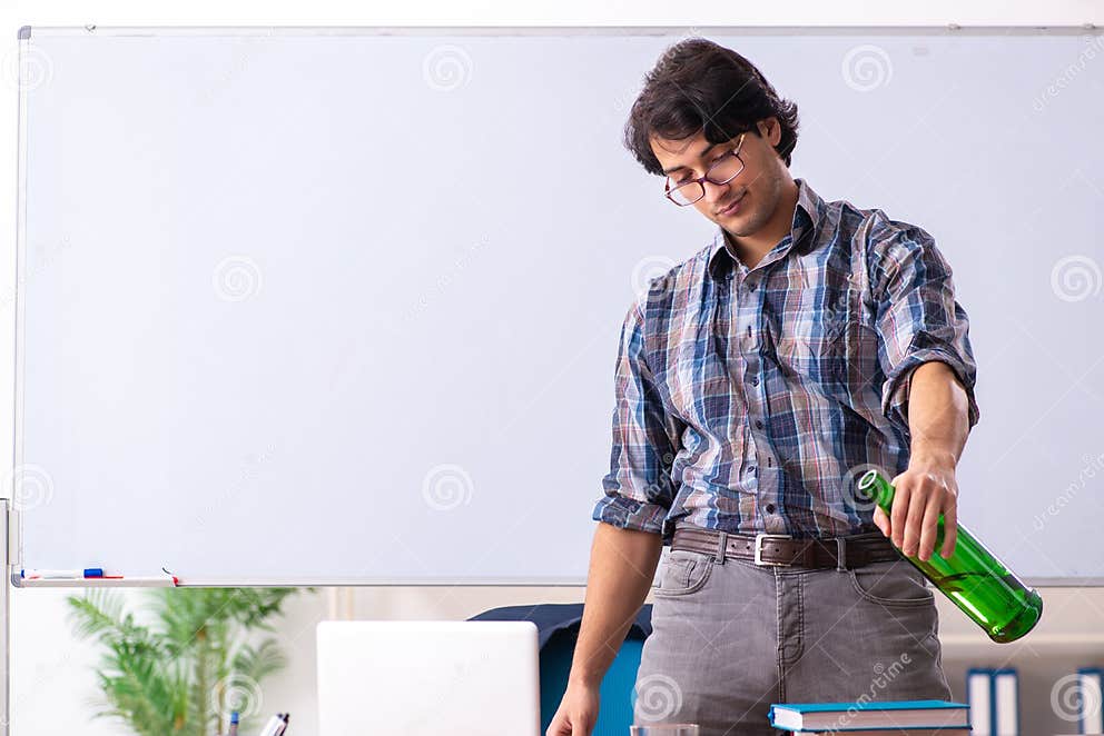 The Male Teacher Drinking in the Classroom Stock Image - Image of ...