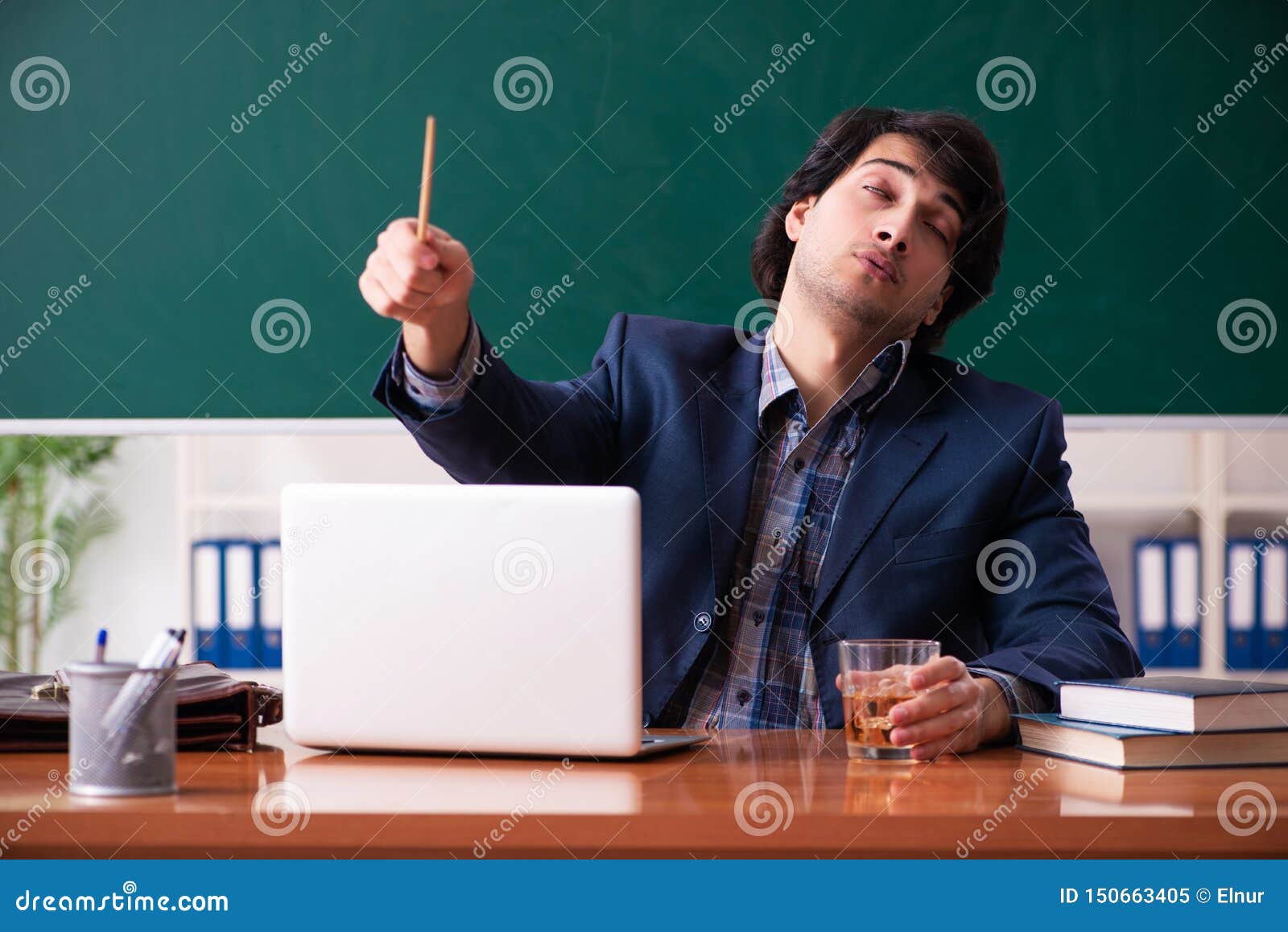 The Male Teacher Drinking in the Classroom Stock Image - Image of drunk ...