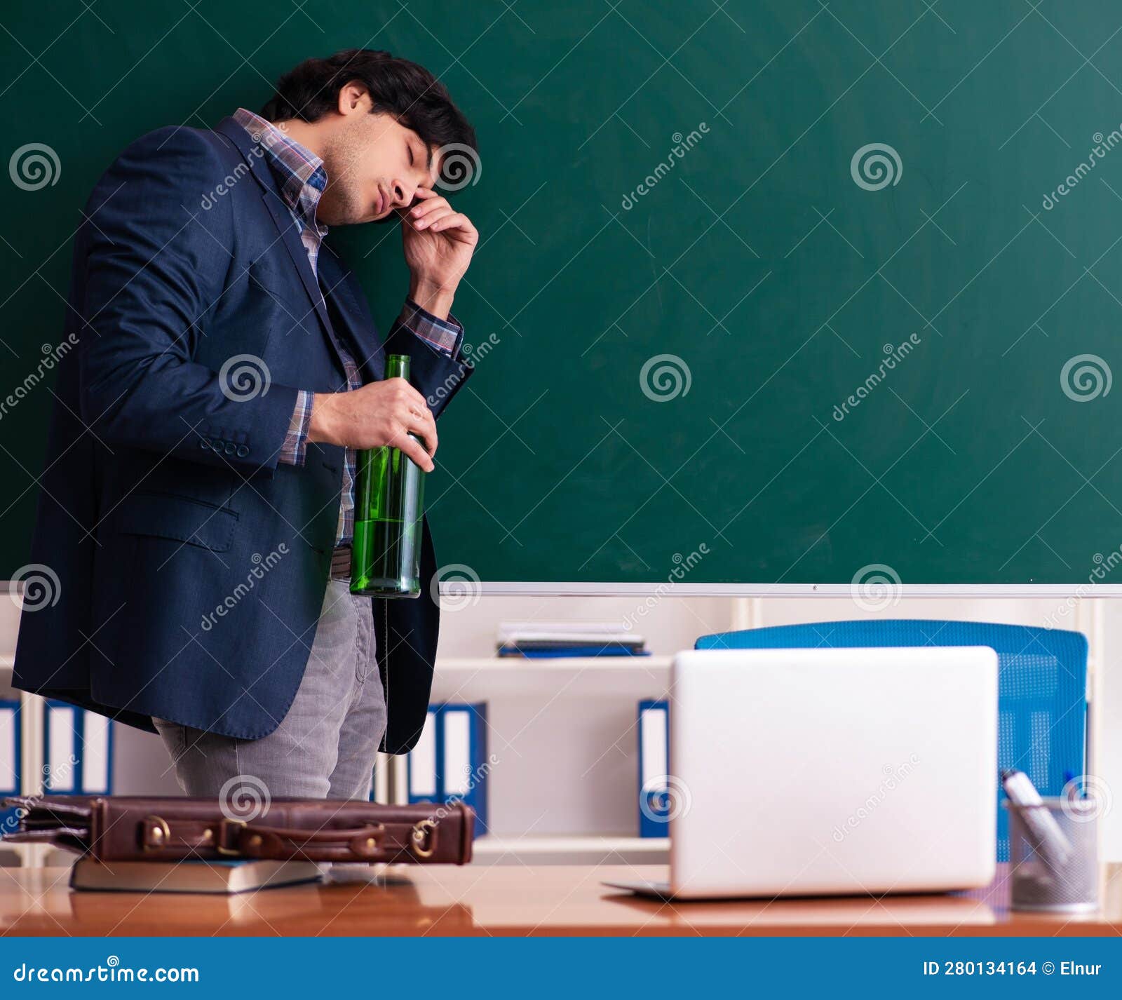Male Teacher Drinking in the Classroom Stock Photo - Image of depressed ...