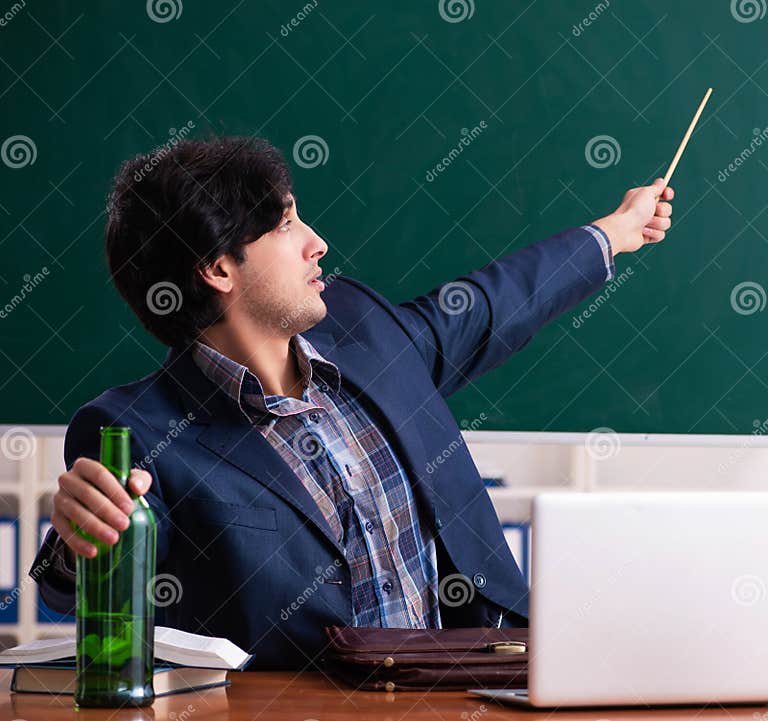 Male Teacher Drinking in the Classroom Stock Image - Image of education ...