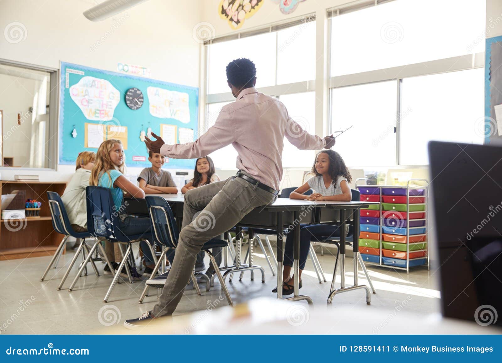 Male Teacher with Elementary School Kids in School Class Stock Image ...