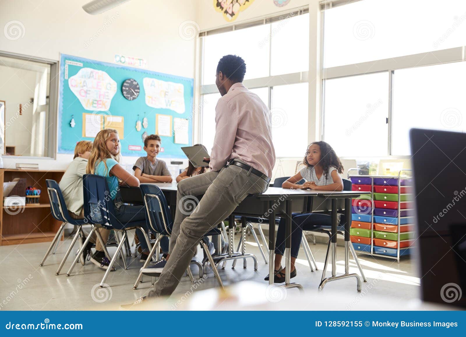 Male Teacher with Elementary School Kids in School Class Stock Image ...