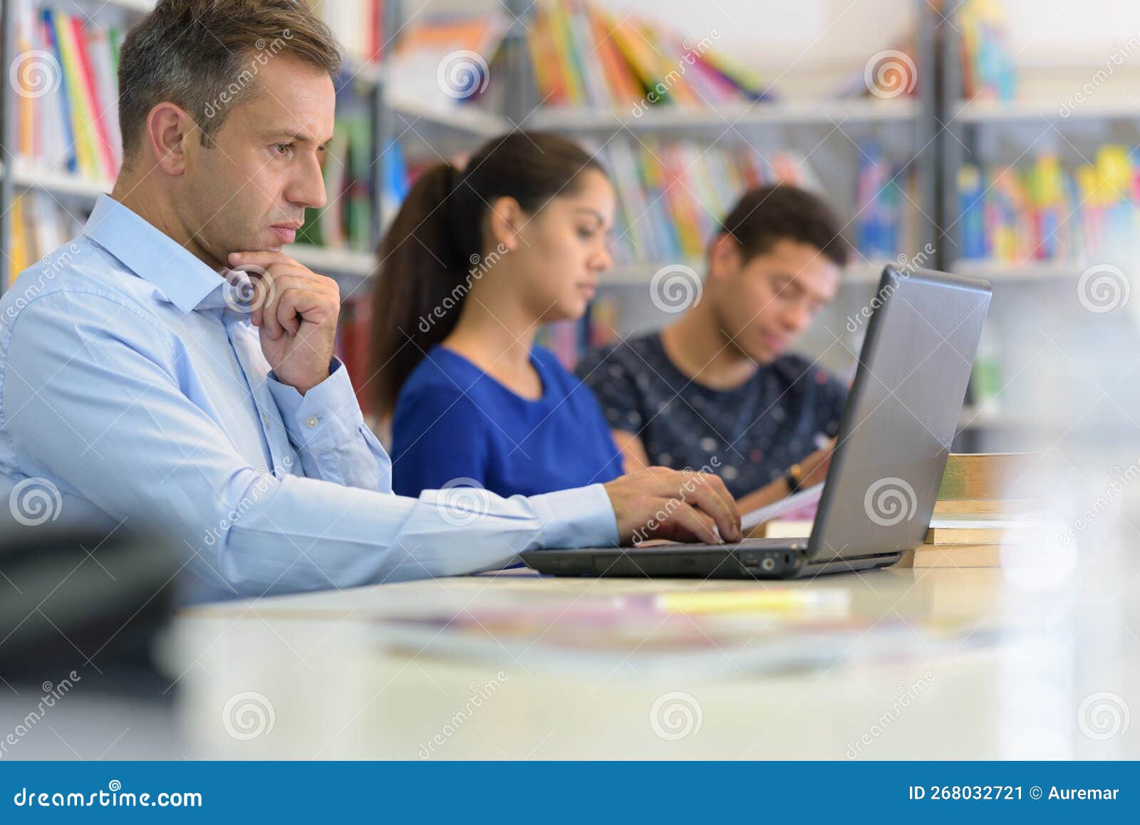 Male Teacher Explaining Topic on Laptop To Student Stock Image - Image ...
