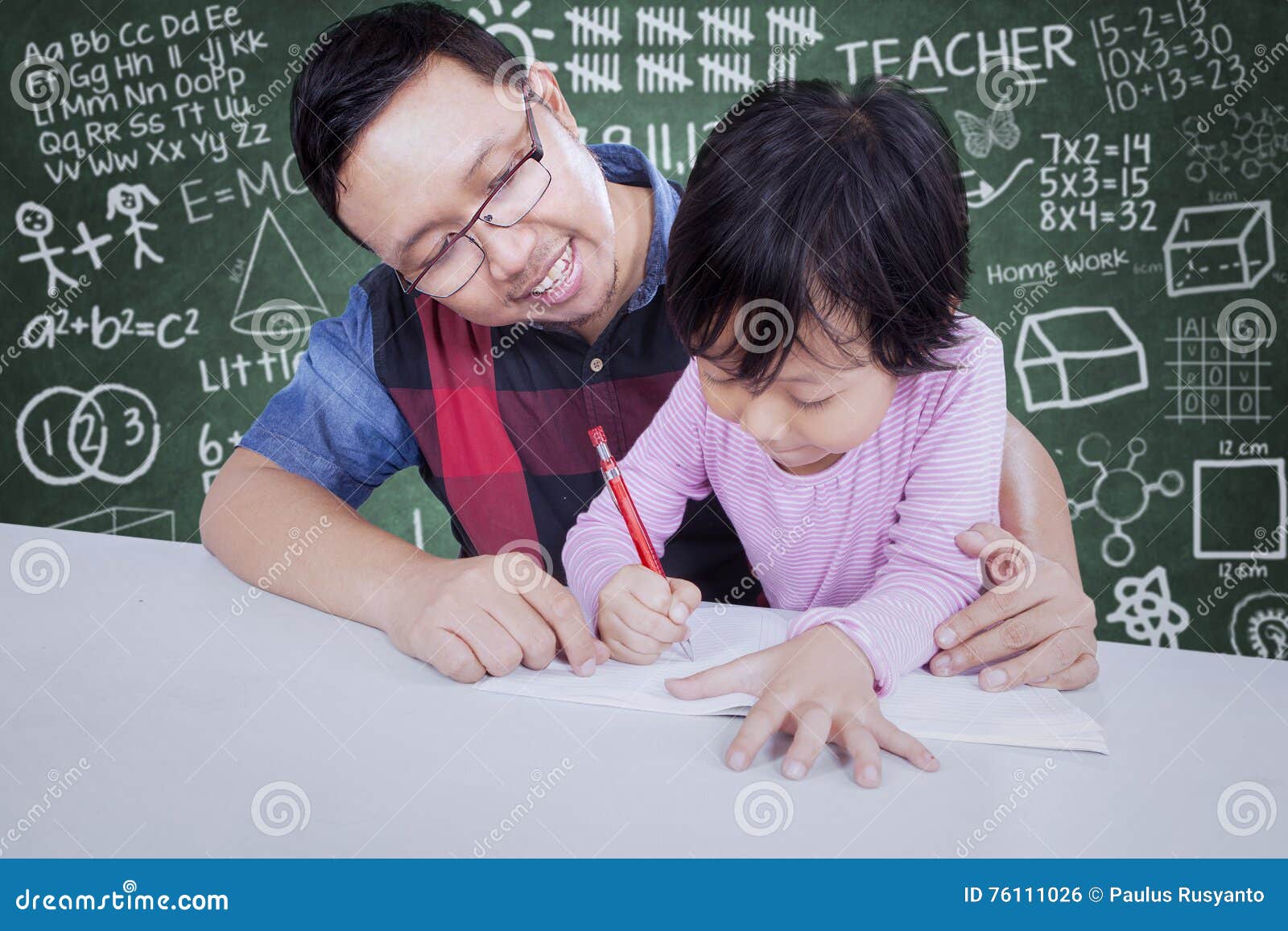 Male Teacher Guide a Student To Write Stock Photo - Image of adult ...