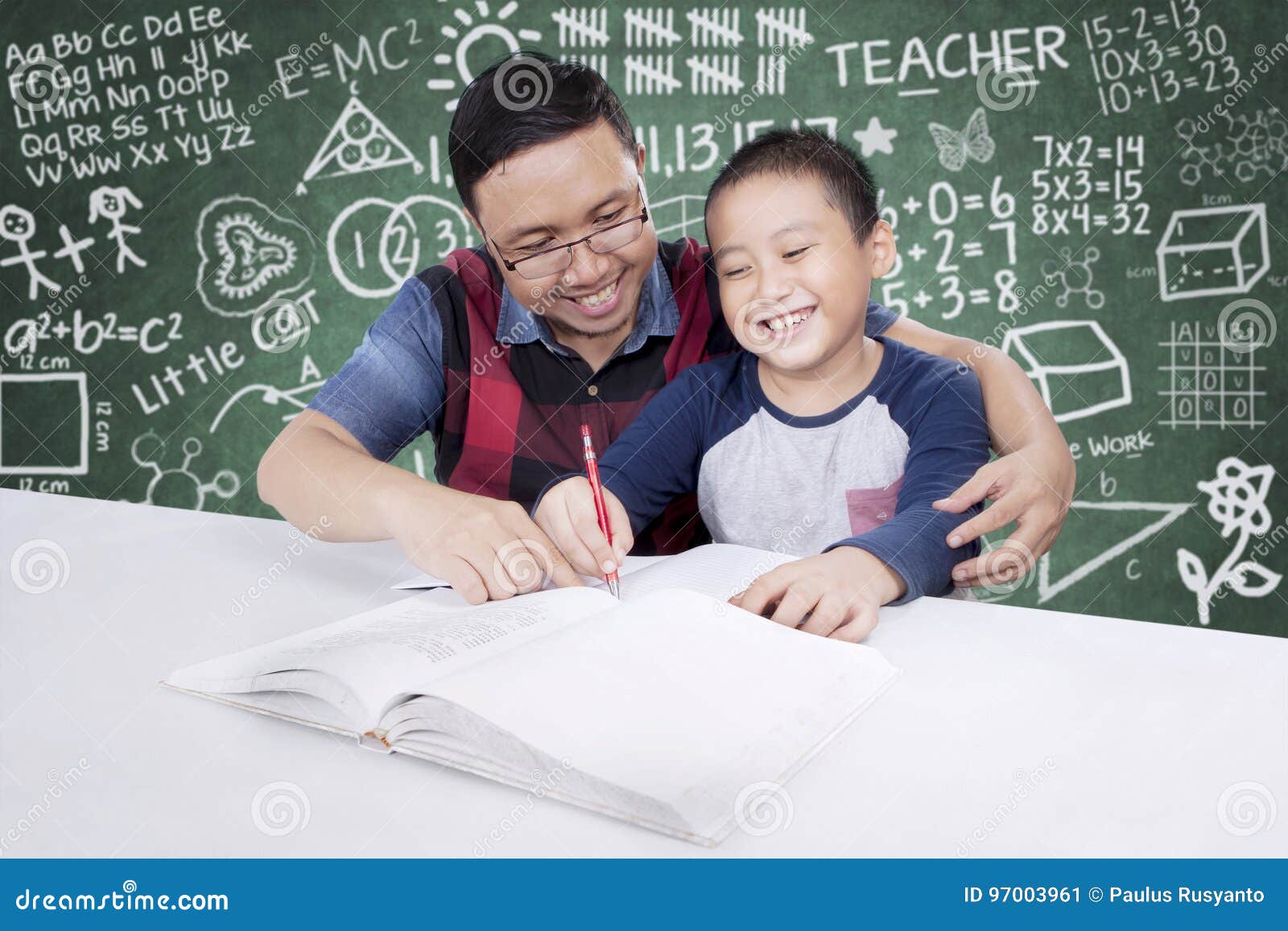 Male Teacher Guides His Student To Learn Stock Image - Image of kids ...