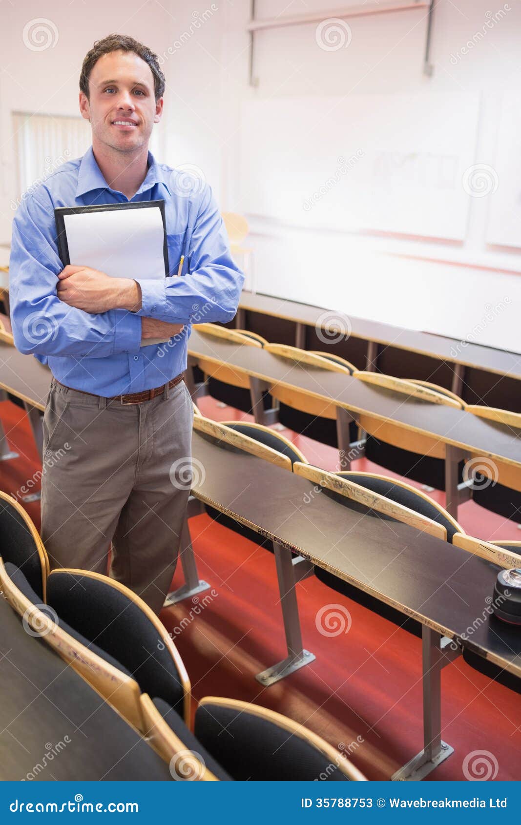 Male Teacher with Notepad in the Lecture Hall Stock Image - Image of ...