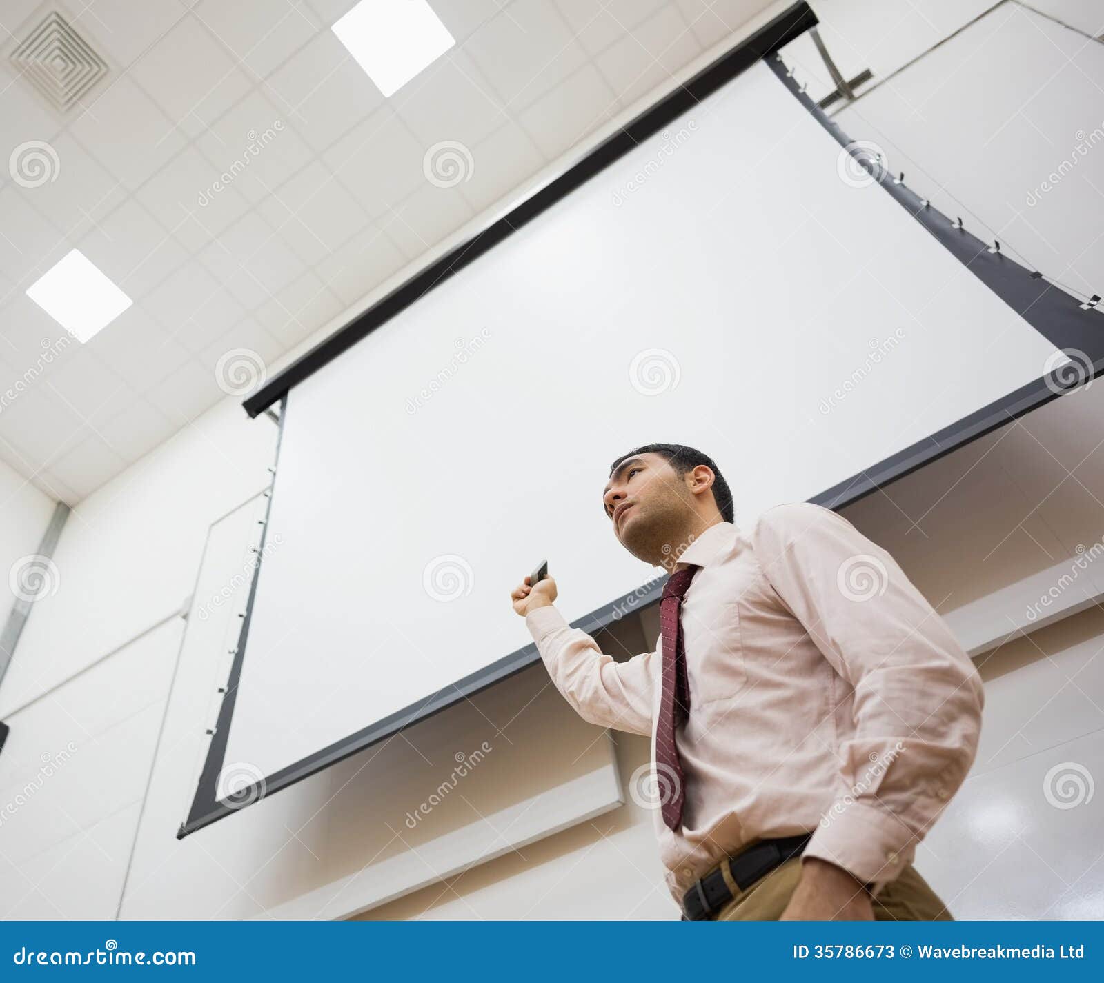Male Teacher with Projection Screen in the Lecture Hall Stock Image ...