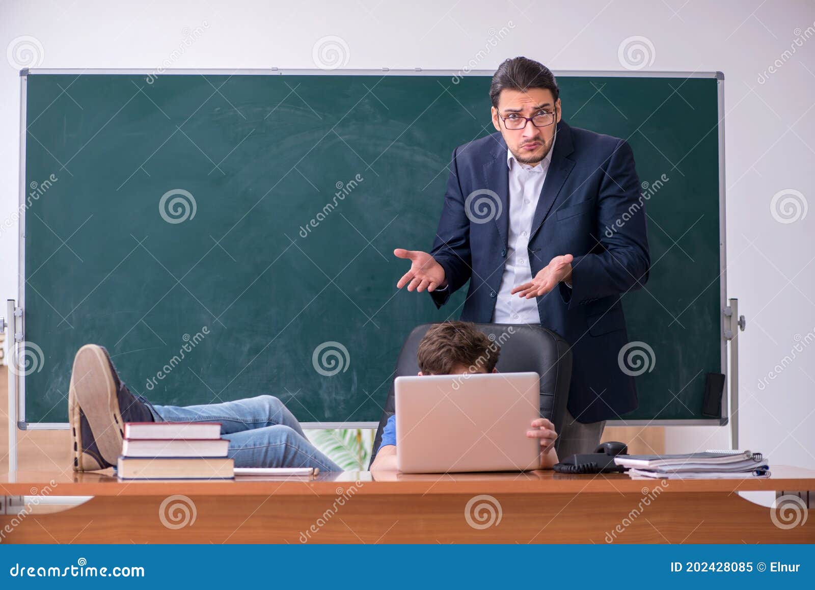 Young Male Teacher and Schoolboy in the Classroom Stock Image - Image ...