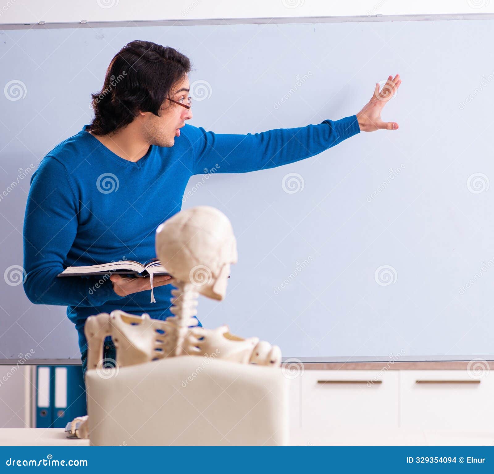 Male Teacher and Skeleton Student in the Classroom Stock Photo - Image ...