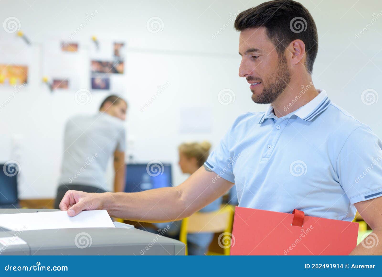 Male Teacher Using Photocopying Machine Stock Photo - Image of ...