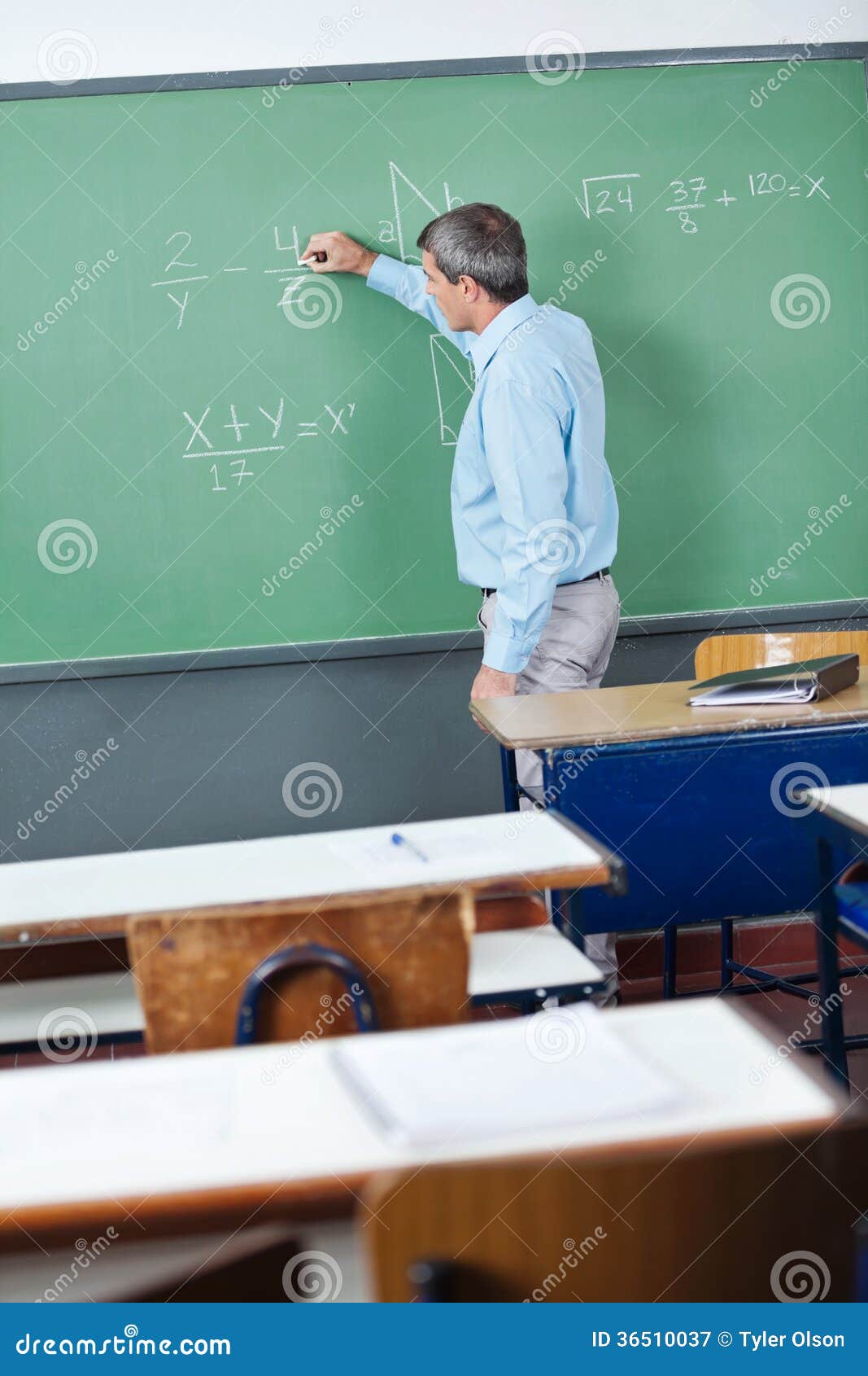 Male Teacher Writing on Greenboard Stock Image - Image of chalk ...