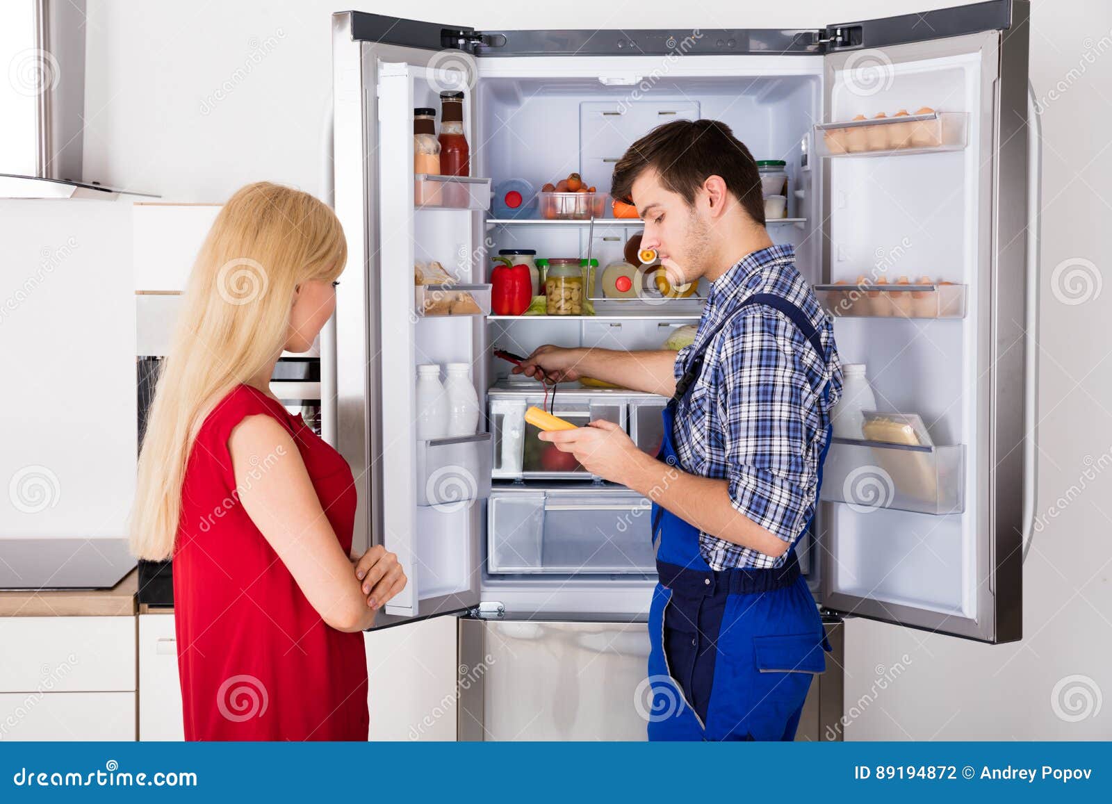 Male Technician Checking Fridge with Digital Multimeter Stock Photo ...