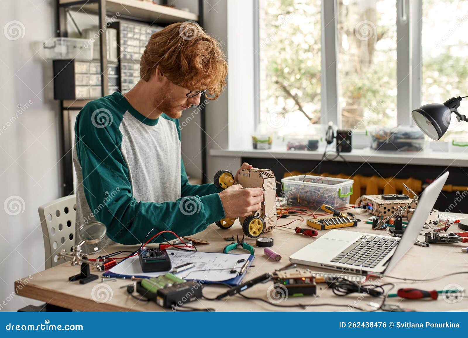 Male it Technician or Engineer Check Wheel Robot Stock Photo - Image of ...