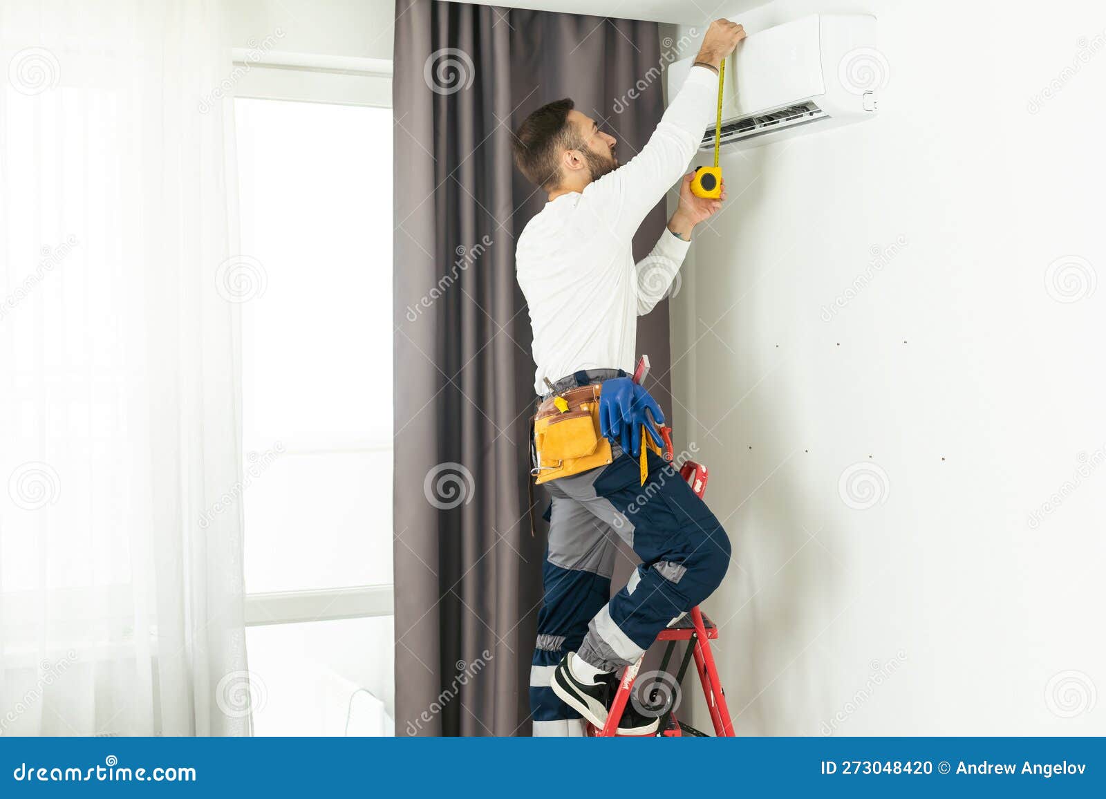 Male Technician Fixing Air Conditioner Indoors. Stock Photo - Image of ...