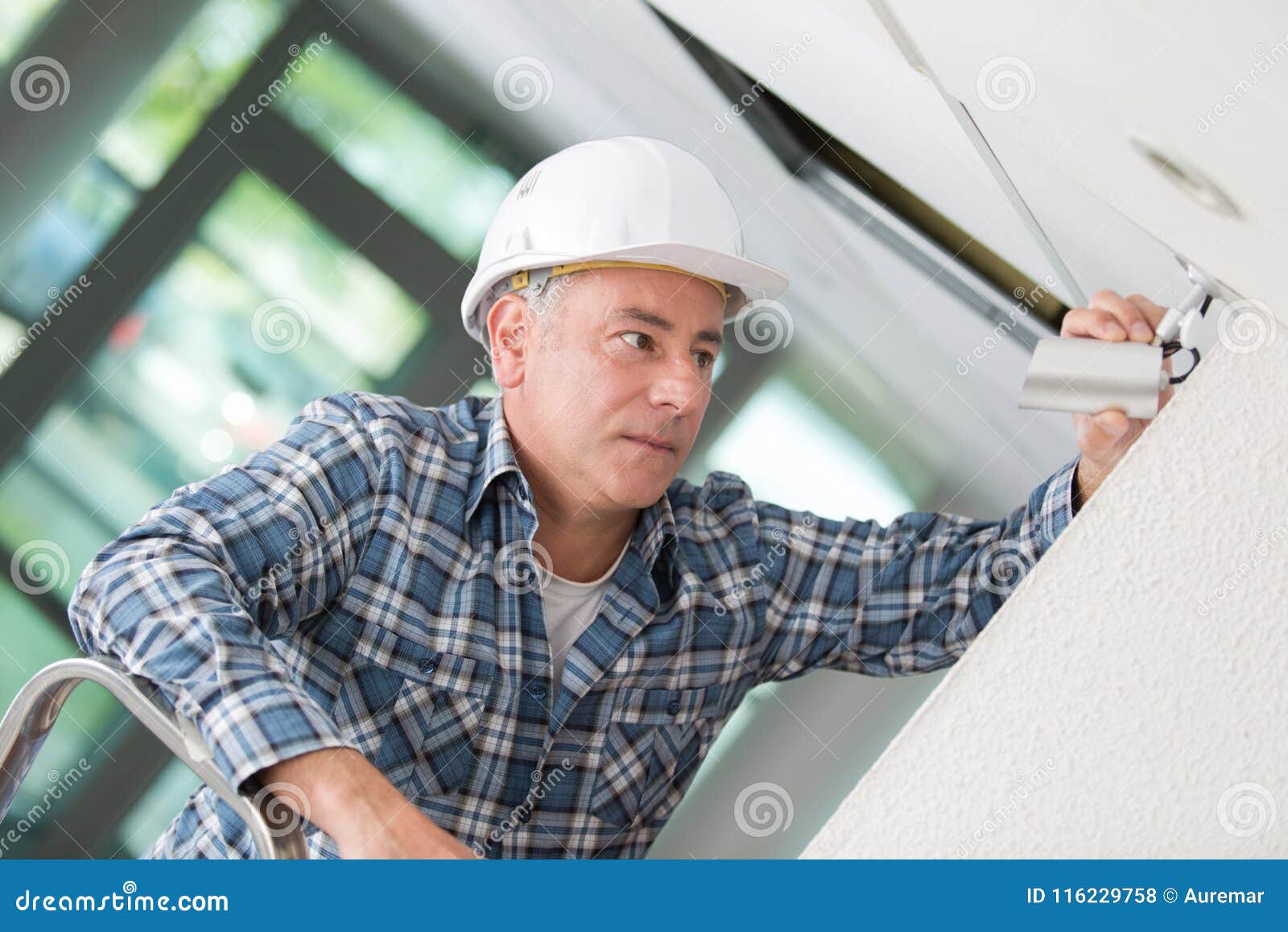 Male Technician Installing Camera on Wall Stock Photo - Image of hard ...