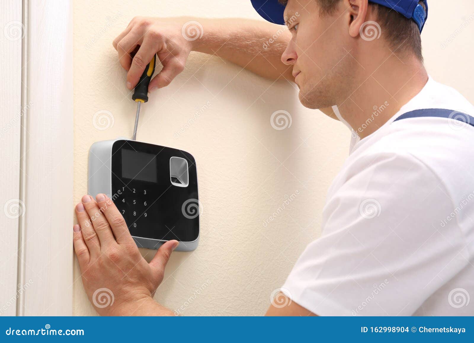 Male Technician Installing Security Alarm System Stock Photo - Image of ... Male Technician Installing Security Alarm System Stock Photo - Image of ...