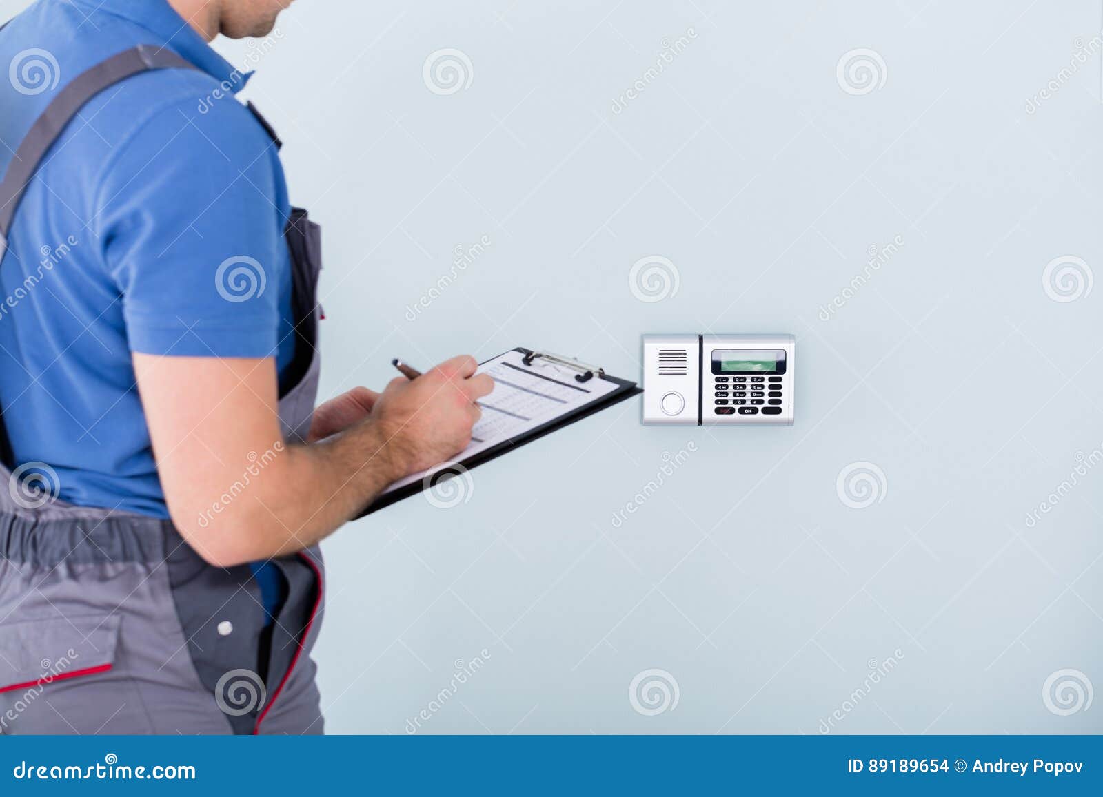 Male Technician in Overall with Security System Stock Photo - Image of ...