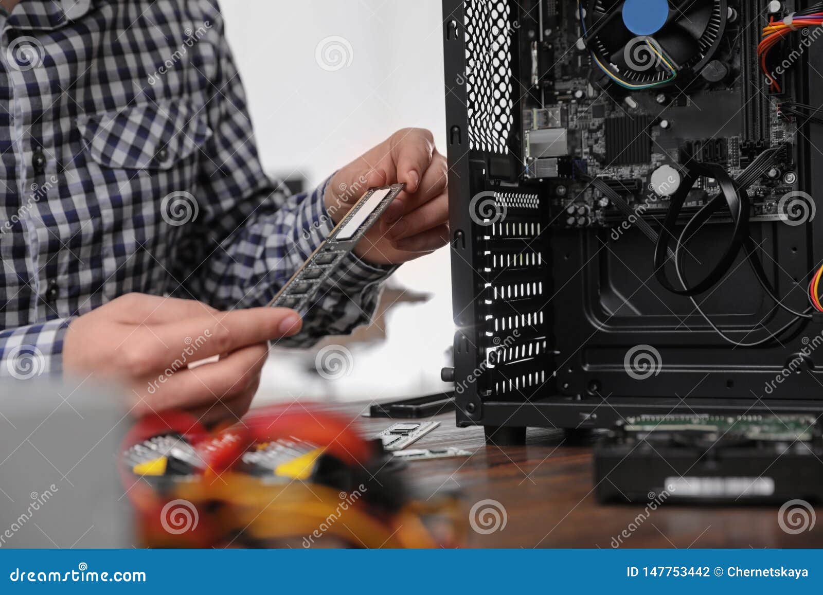 Male Technician Repairing Computer at Table Stock Photo - Image of hand ...