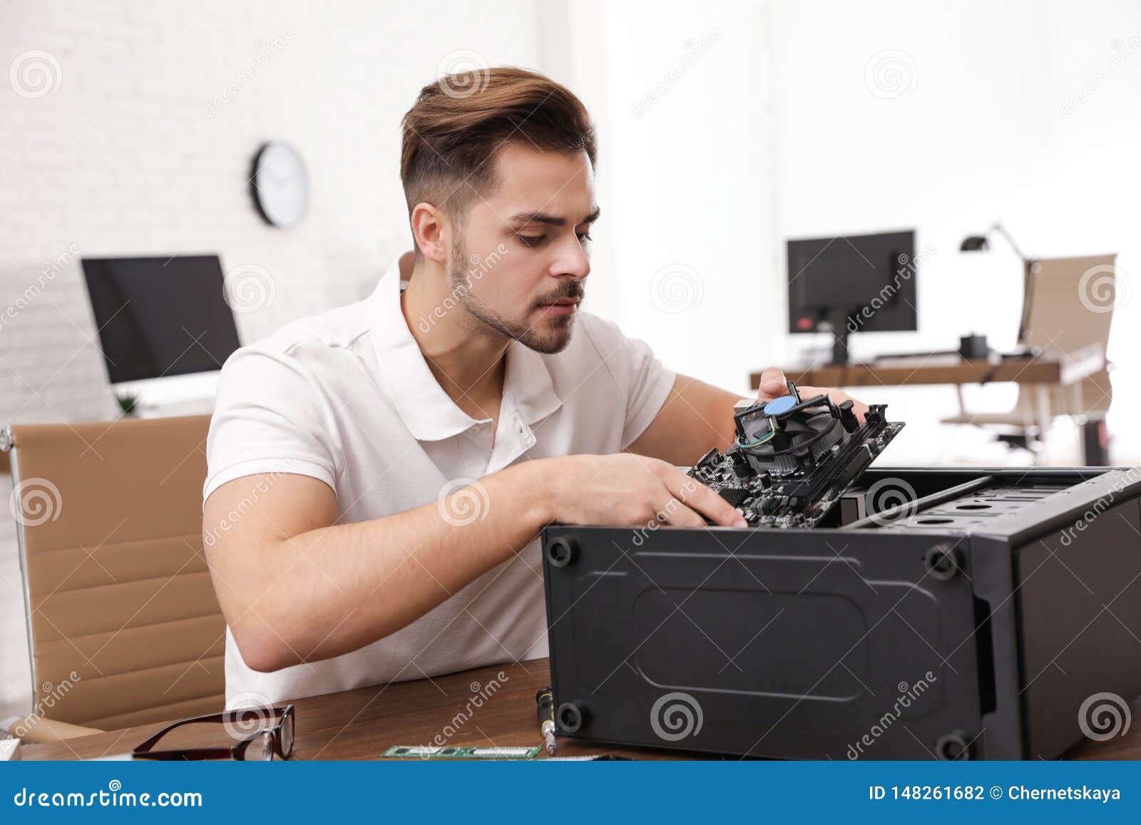 Male Technician Repairing Computer at Table Stock Photo - Image of ...