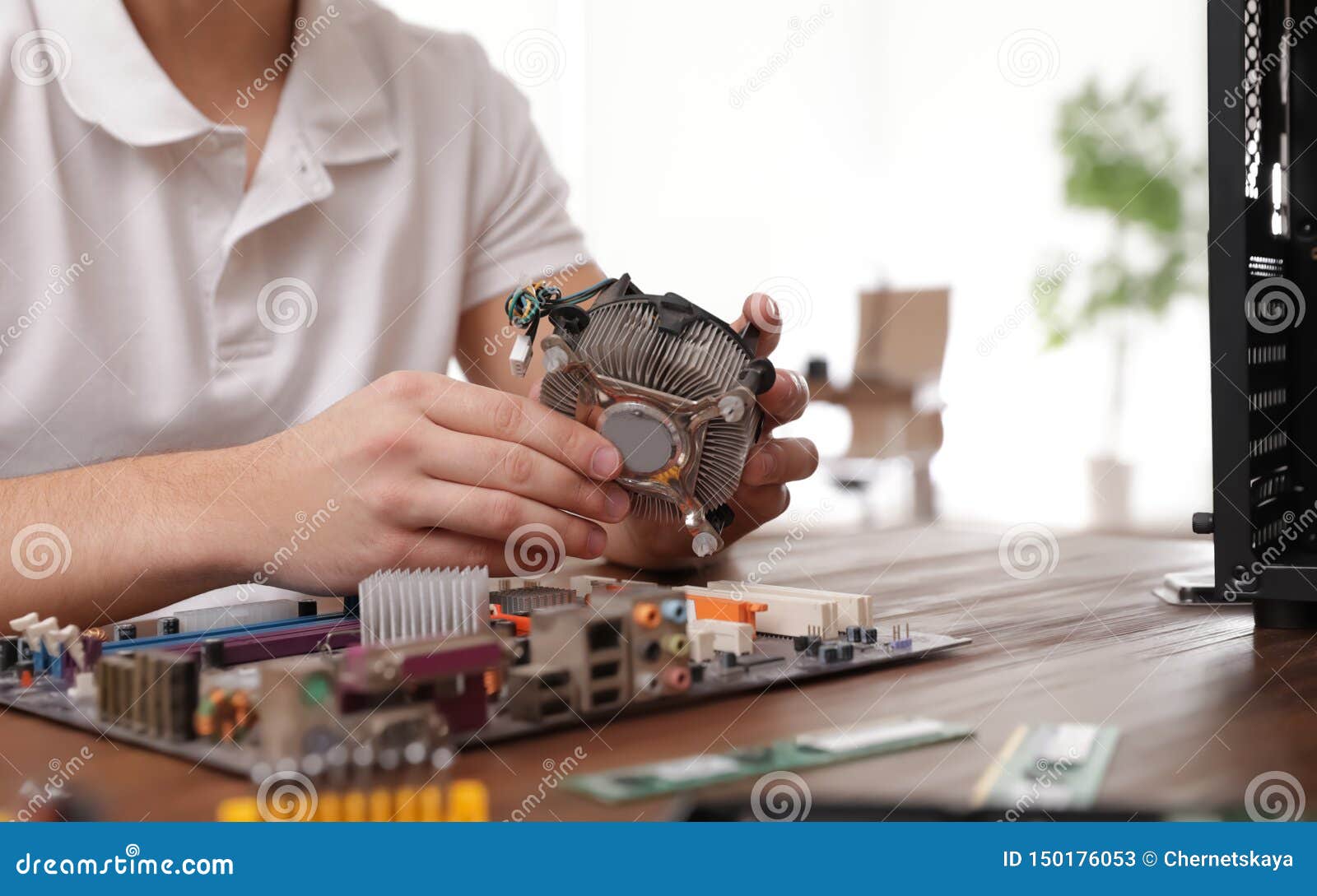 Male Technician Repairing Computer at Table Indoors Stock Image - Image ...