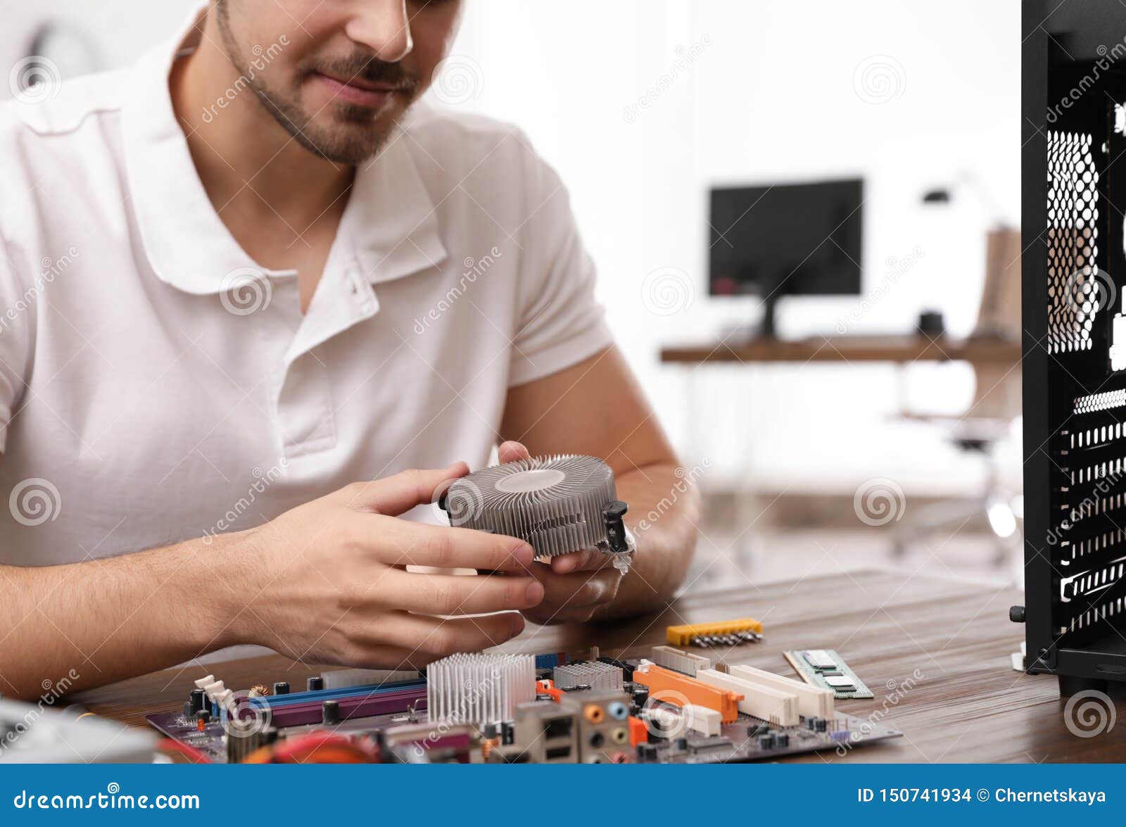 Male Technician Repairing Computer at Table Indoors Stock Photo - Image ...