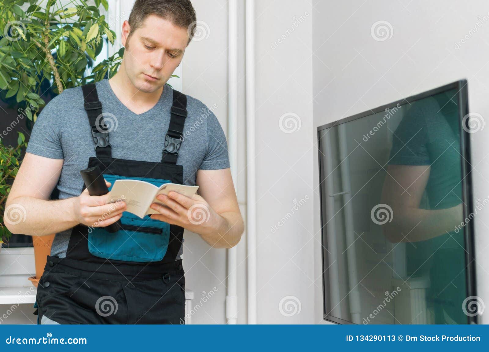 Male setting up TV stock image. Image of house, setup - 134290113