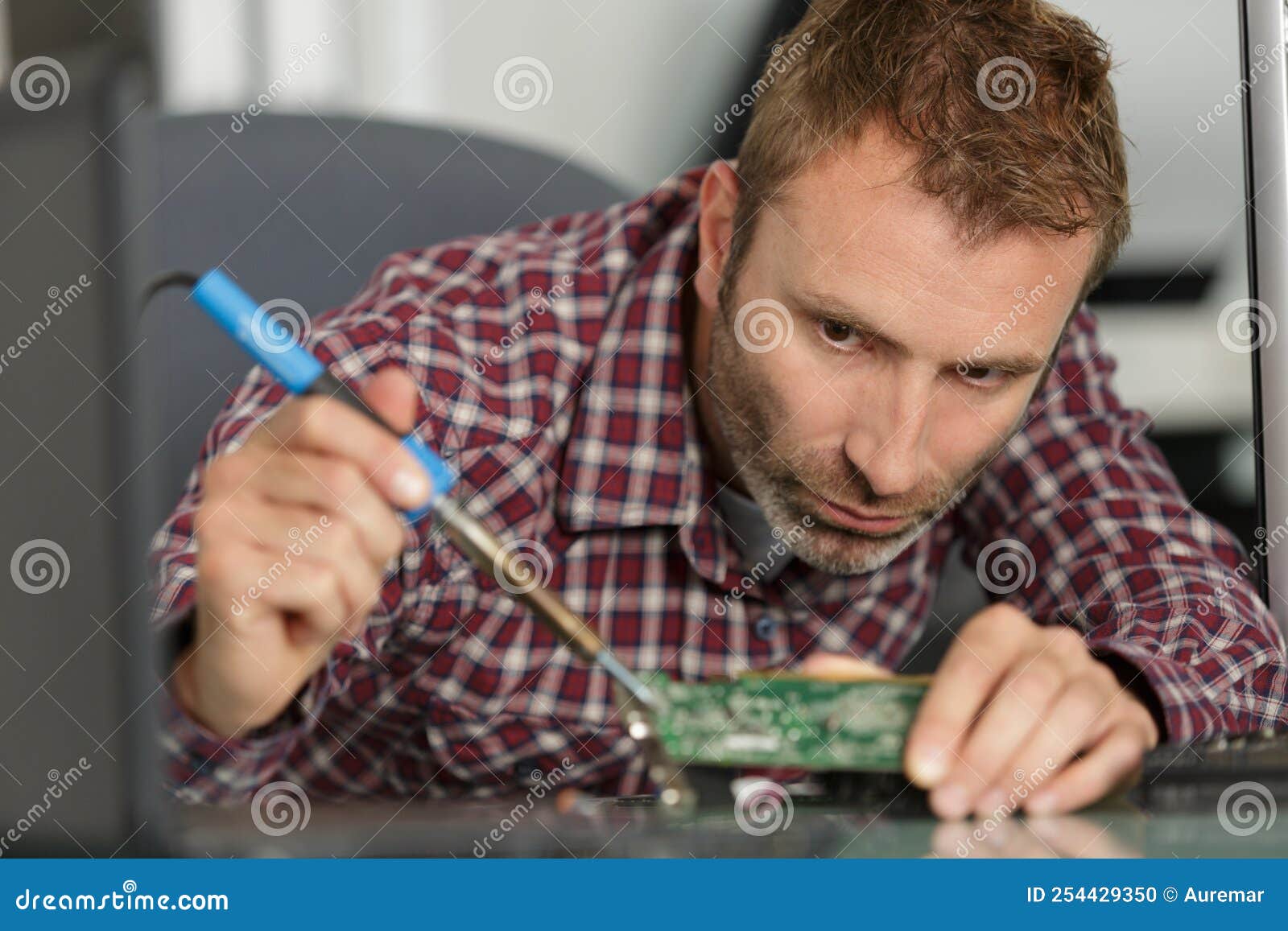 Male Technician Soldering Computer Component Stock Photo - Image of ...