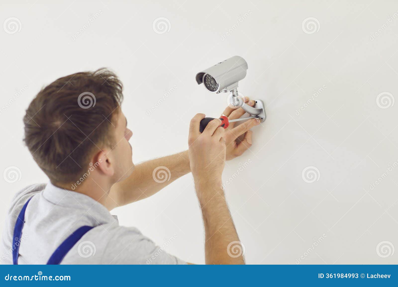 Portrait of Young Technician Man Installing Surveillance CCTV Camera on ...