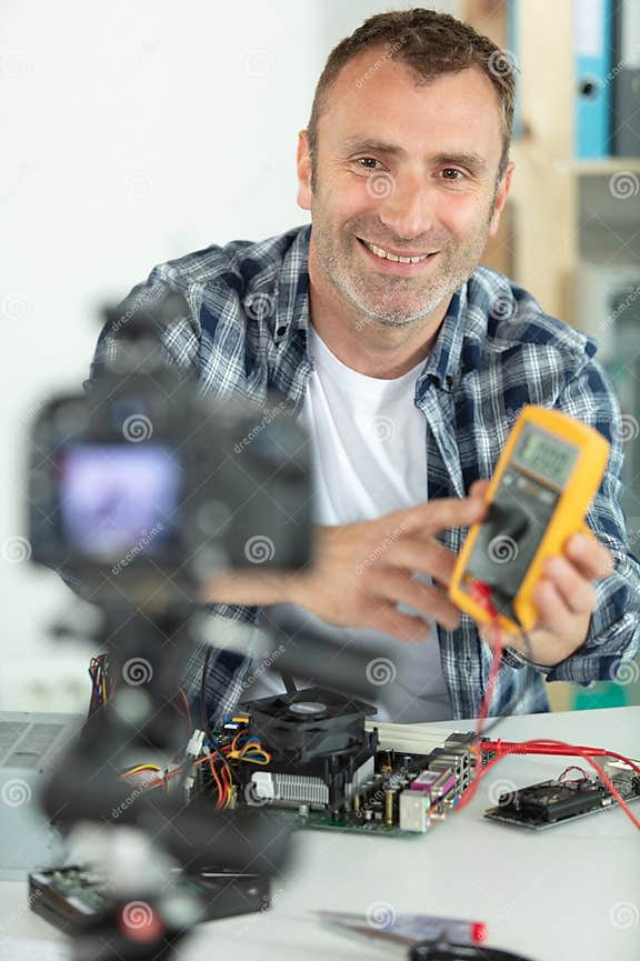 Male Technician Using Camera To Make Tutorial Stock Photo - Image of ...