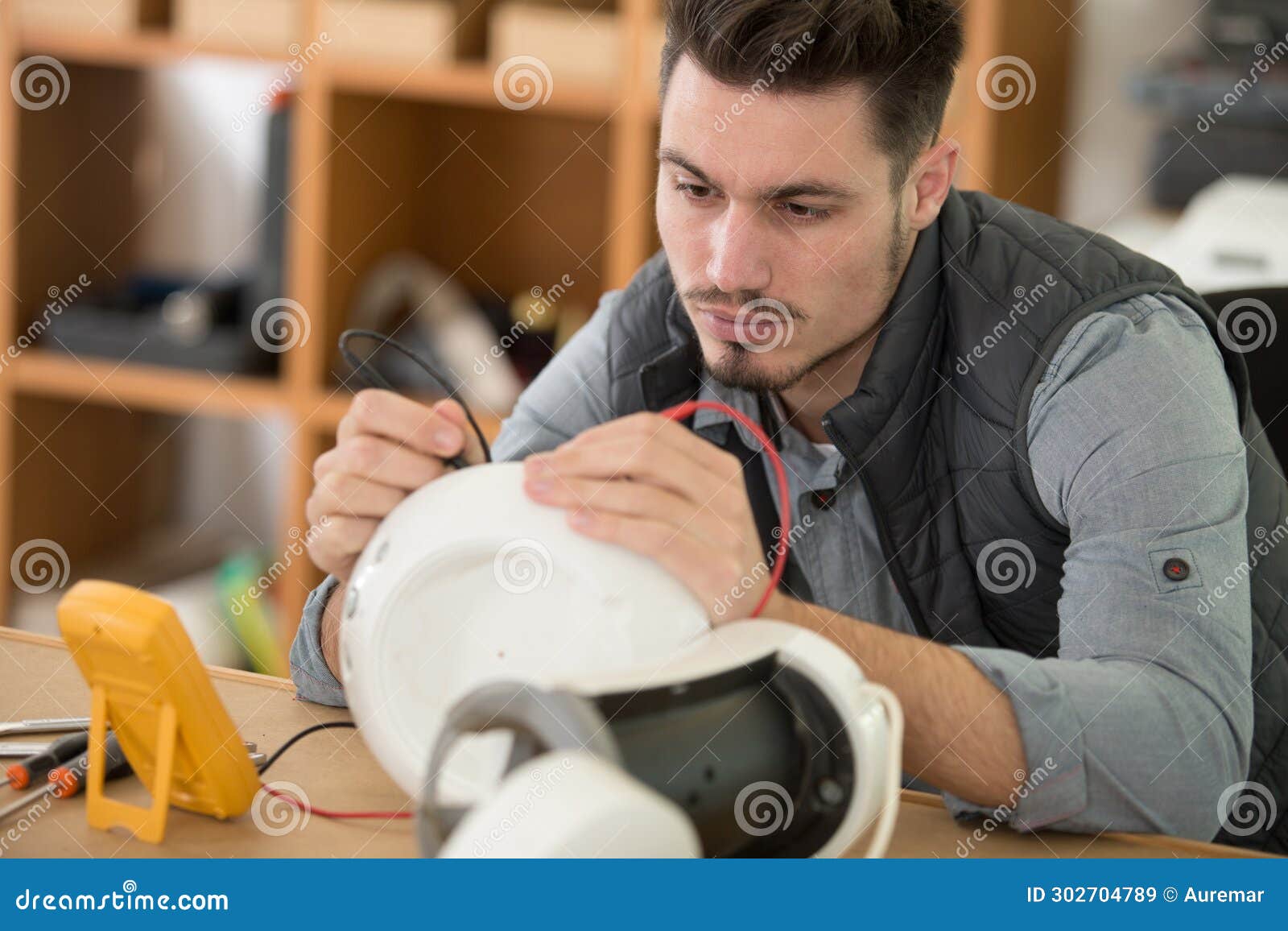 Male Technician Using Multimeter To Test Appliance Stock Image - Image ...