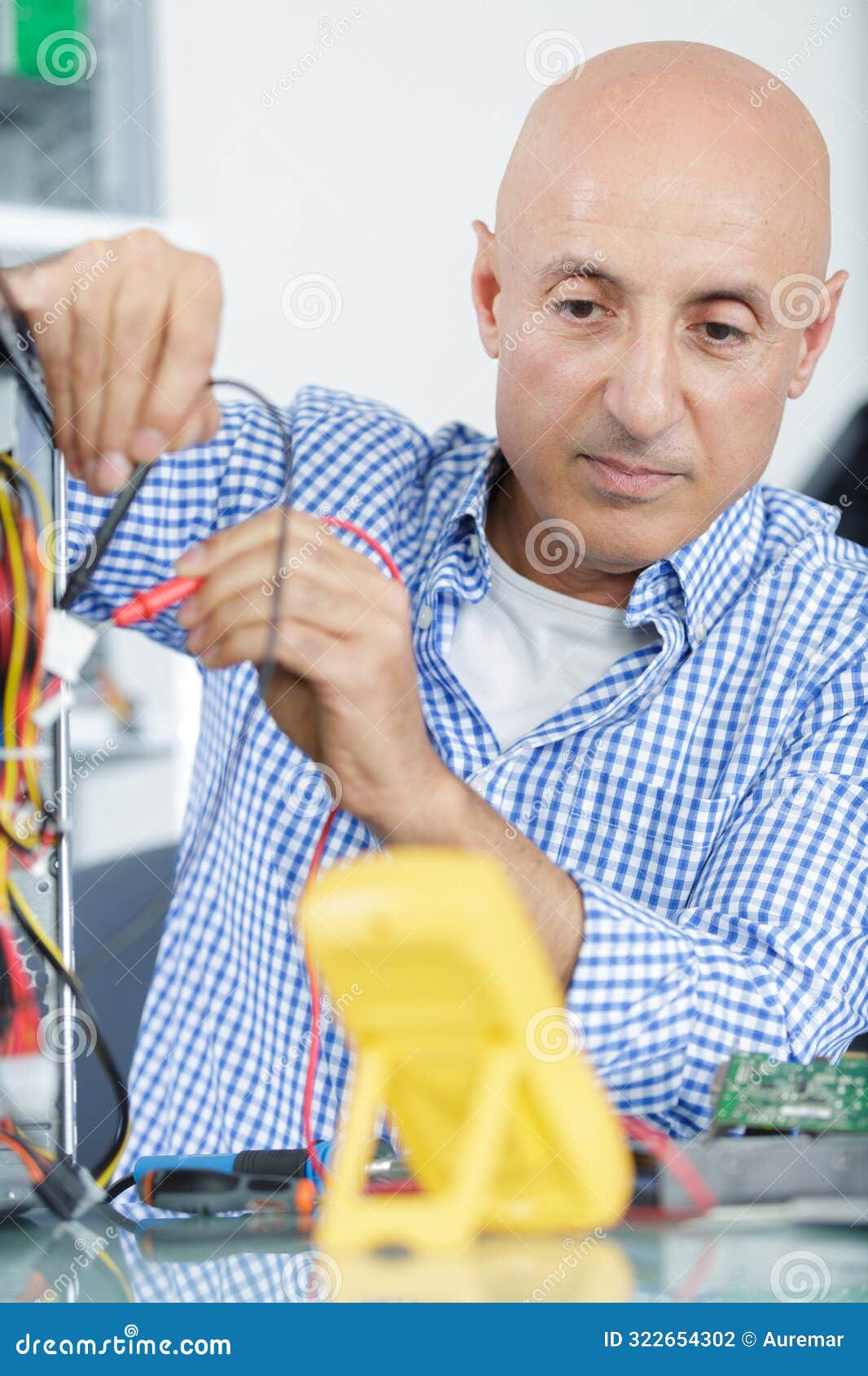 Male Technician Using Voltage Meter Stock Photo - Image of area ...