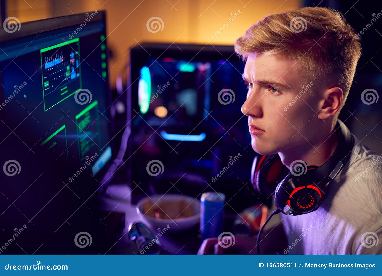 Male Teenage Hacker Sitting in Front of Computer Screens Bypassing ...