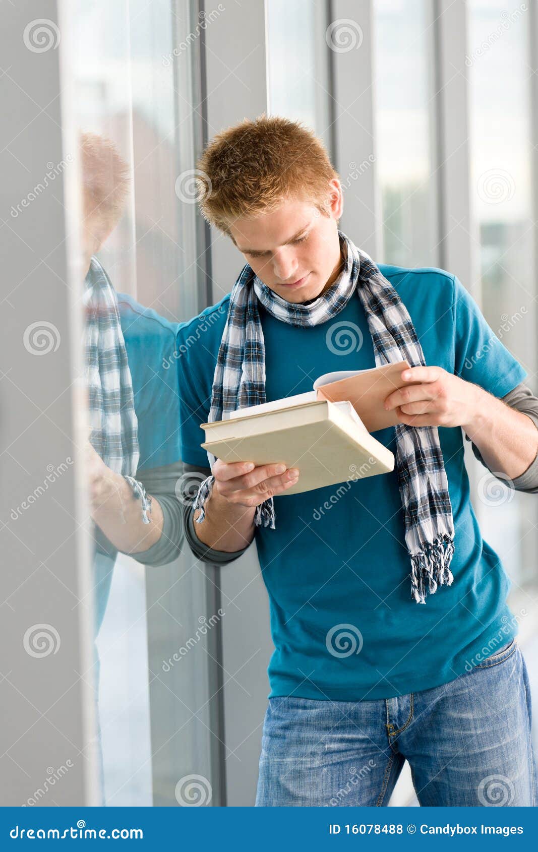 Male teenager read book stock photo. Image of read, holding - 16078488