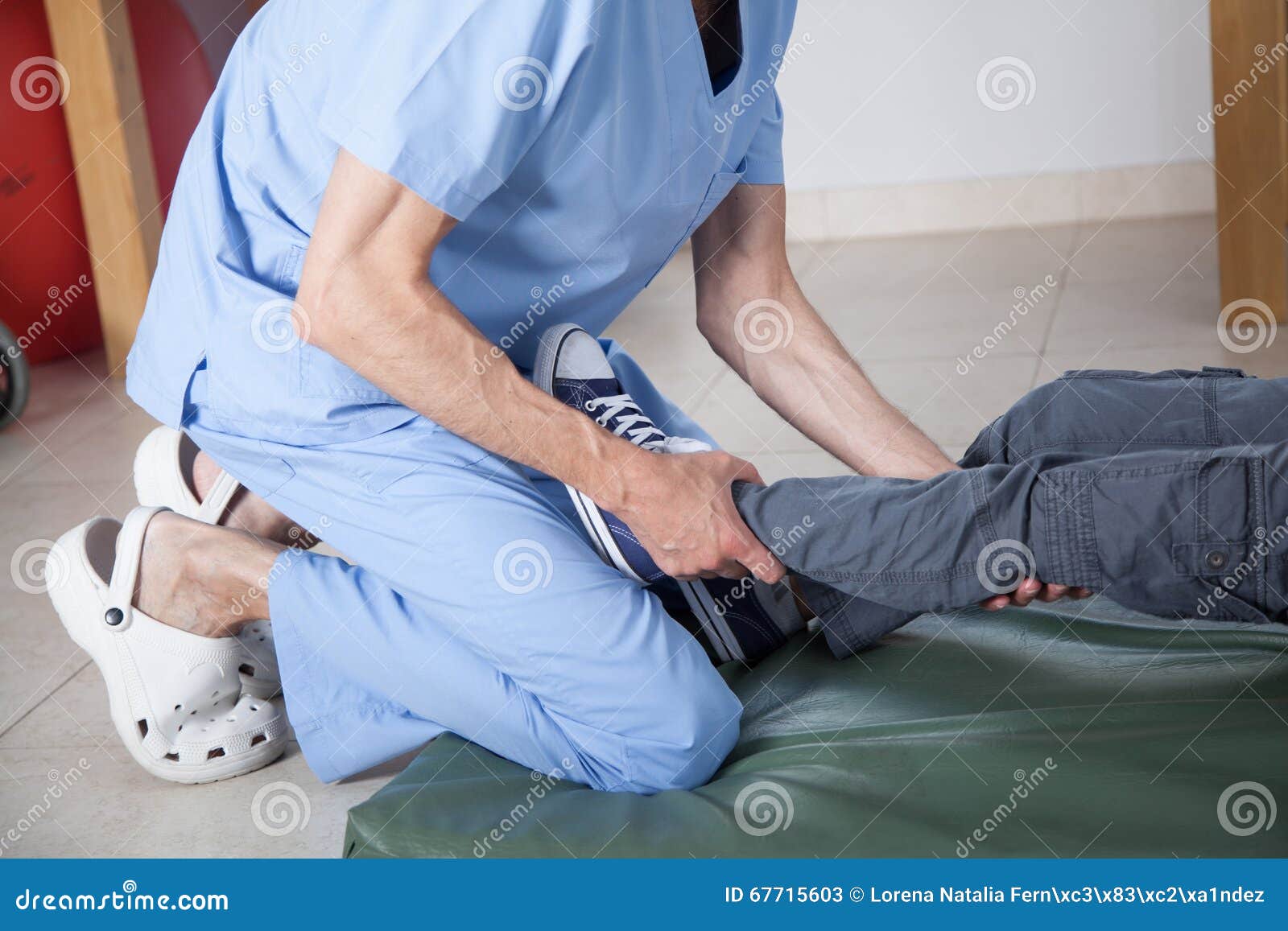 Male therapist with boy stock image. Image of physiotherapy - 67715603