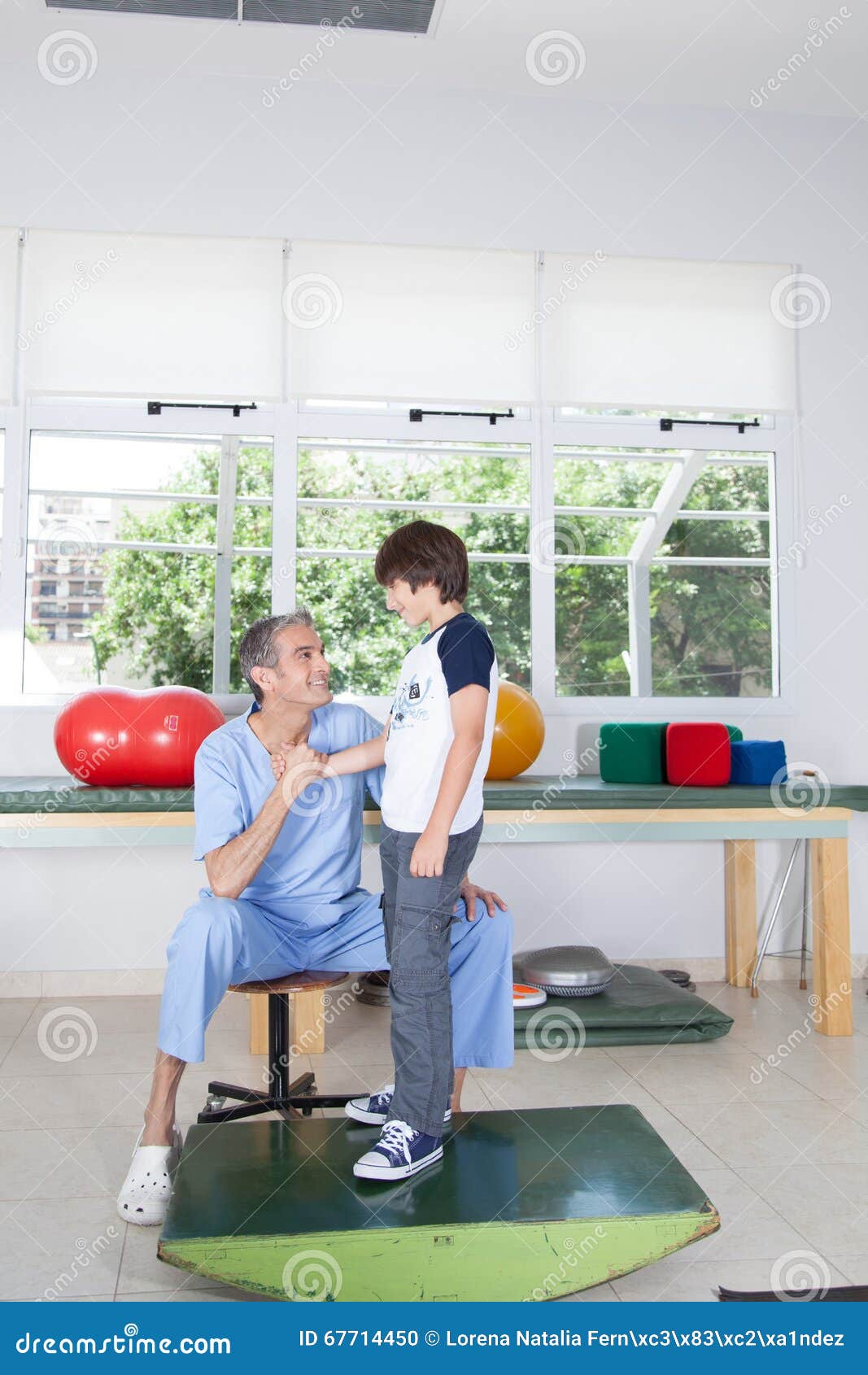 Male Therapist with Boy in Rehab Stock Photo - Image of medical ...