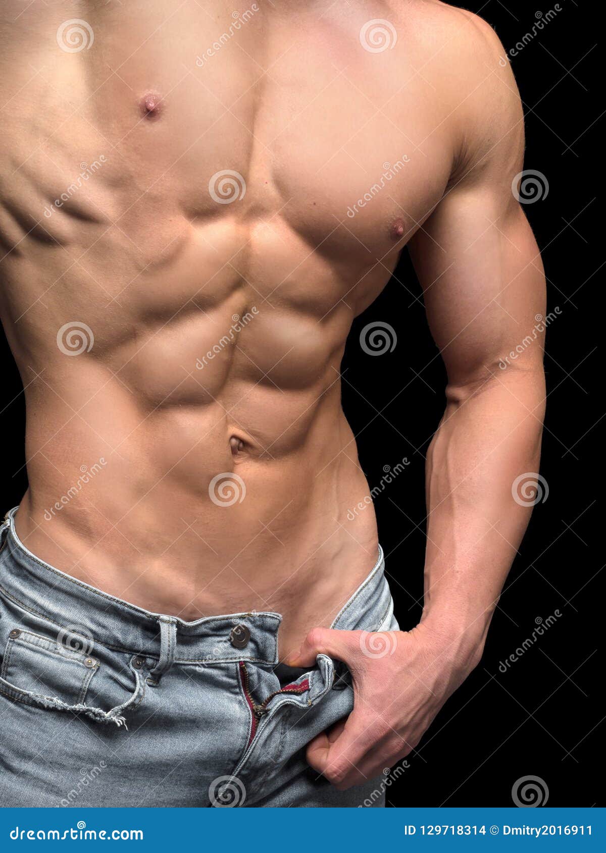 Male Torso in Blue Jeans Showing His Abs Stock Photo - Image of body, sensuality: 129718314