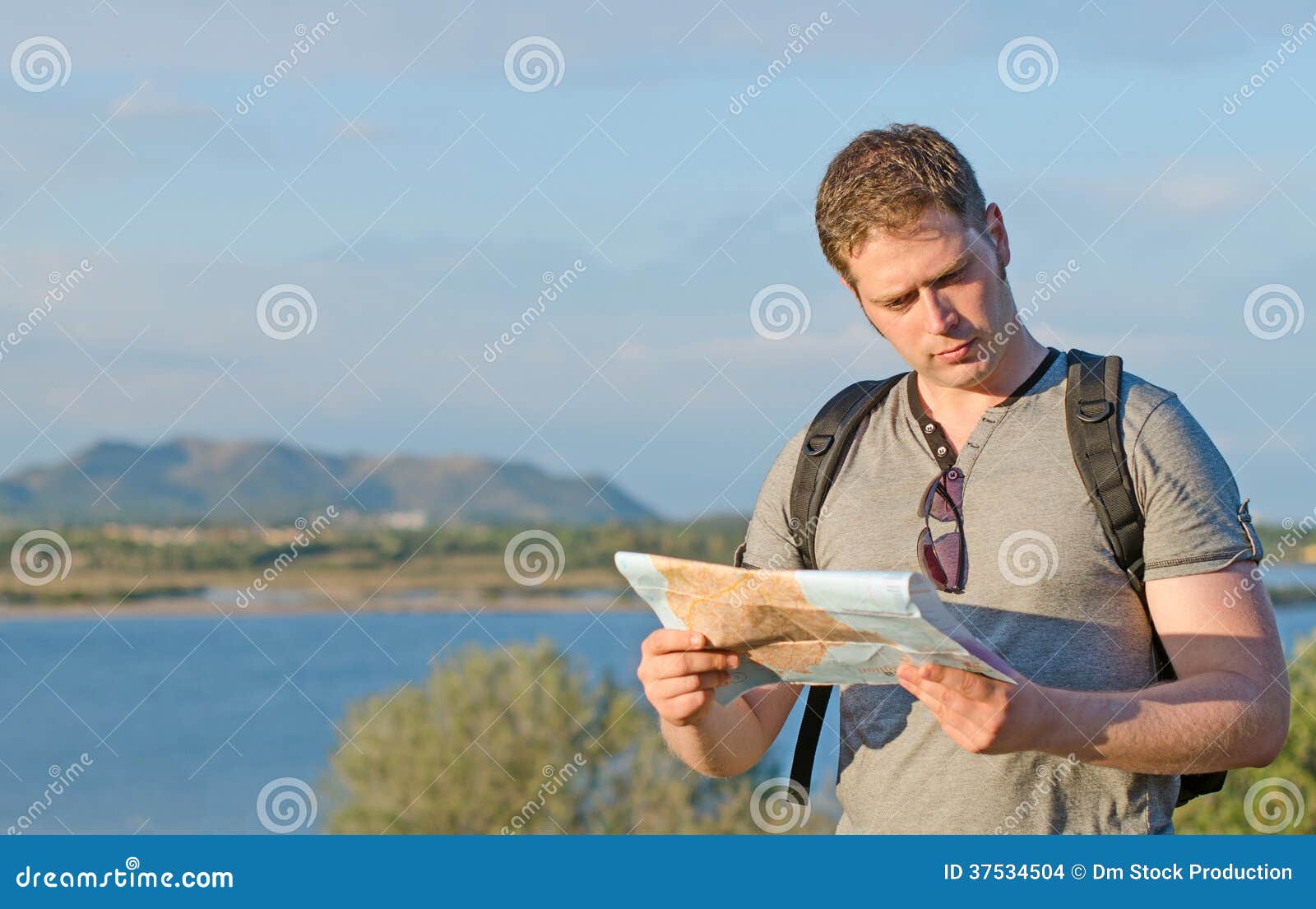 Male tourist with map. stock photo. Image of adventure - 37534504