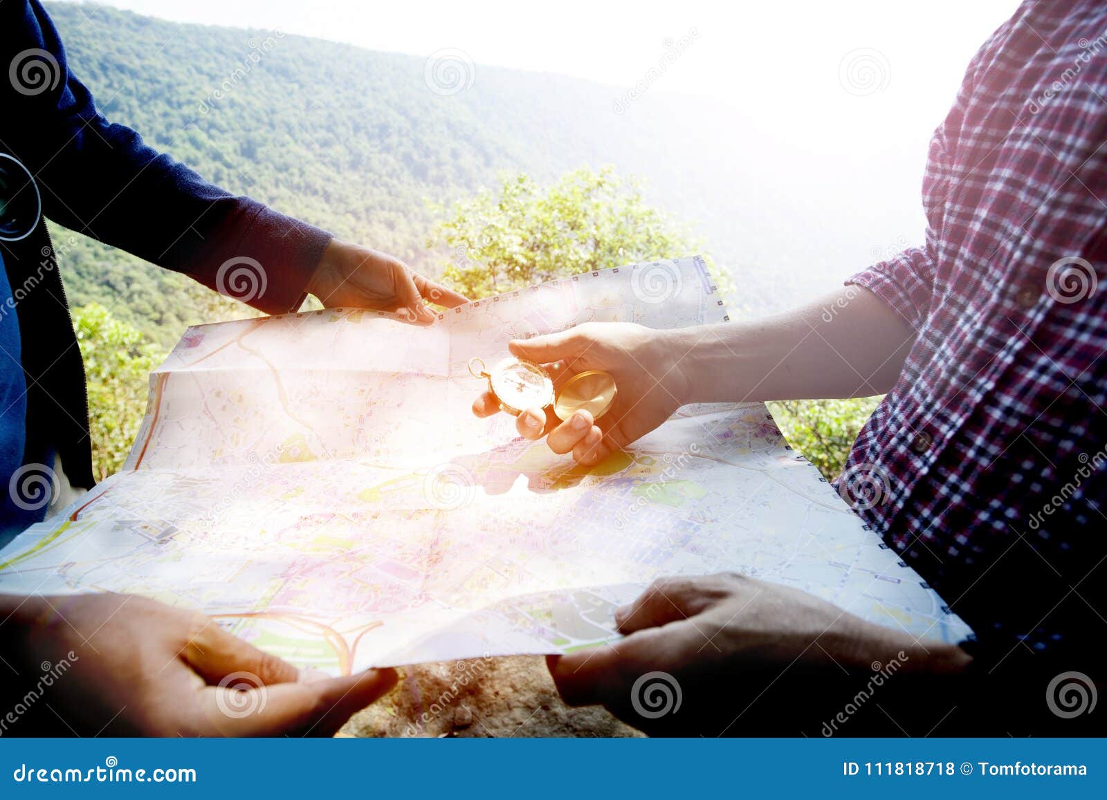 Male Traveler Holding a Compass and Looking the Map Stock Photo - Image ...