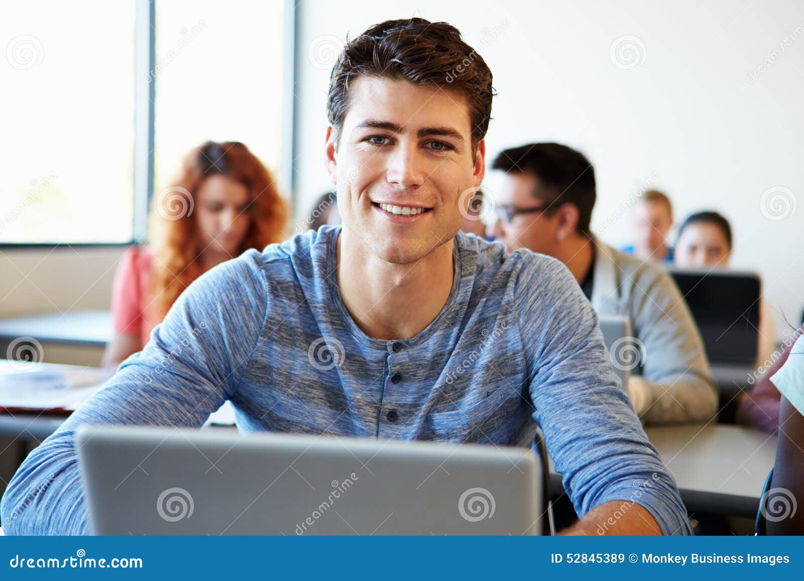 Male University Student Using Laptop in Classroom Stock Image - Image ...