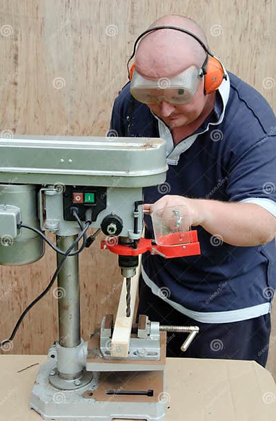 Male Using a Drill Press on Wood Stock Photo - Image of woodworking ...