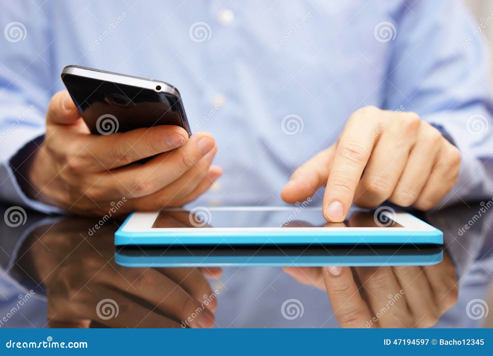 Male is Using Smart Mobile Phone and Tablet Computer at the Same Stock ...