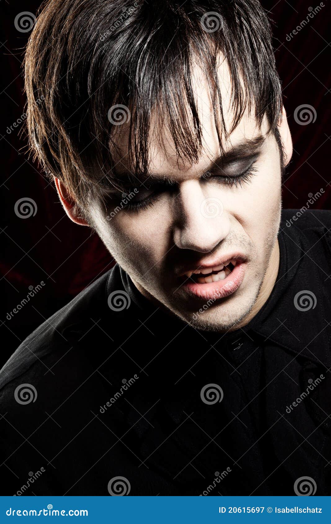 Male Vampire Smiling Dangerously, Showing Fangs Stock Photo ...