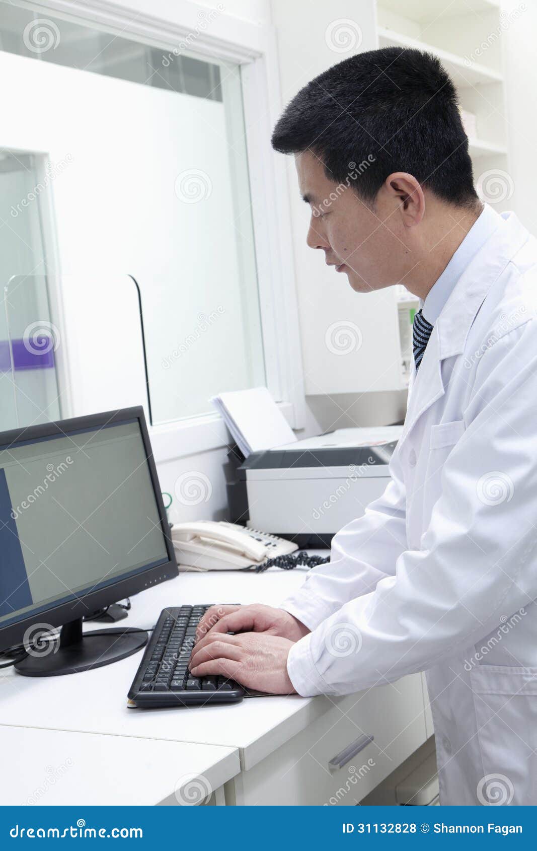 Male Veterinarian Using Computer Stock Photo - Image of hospital ...